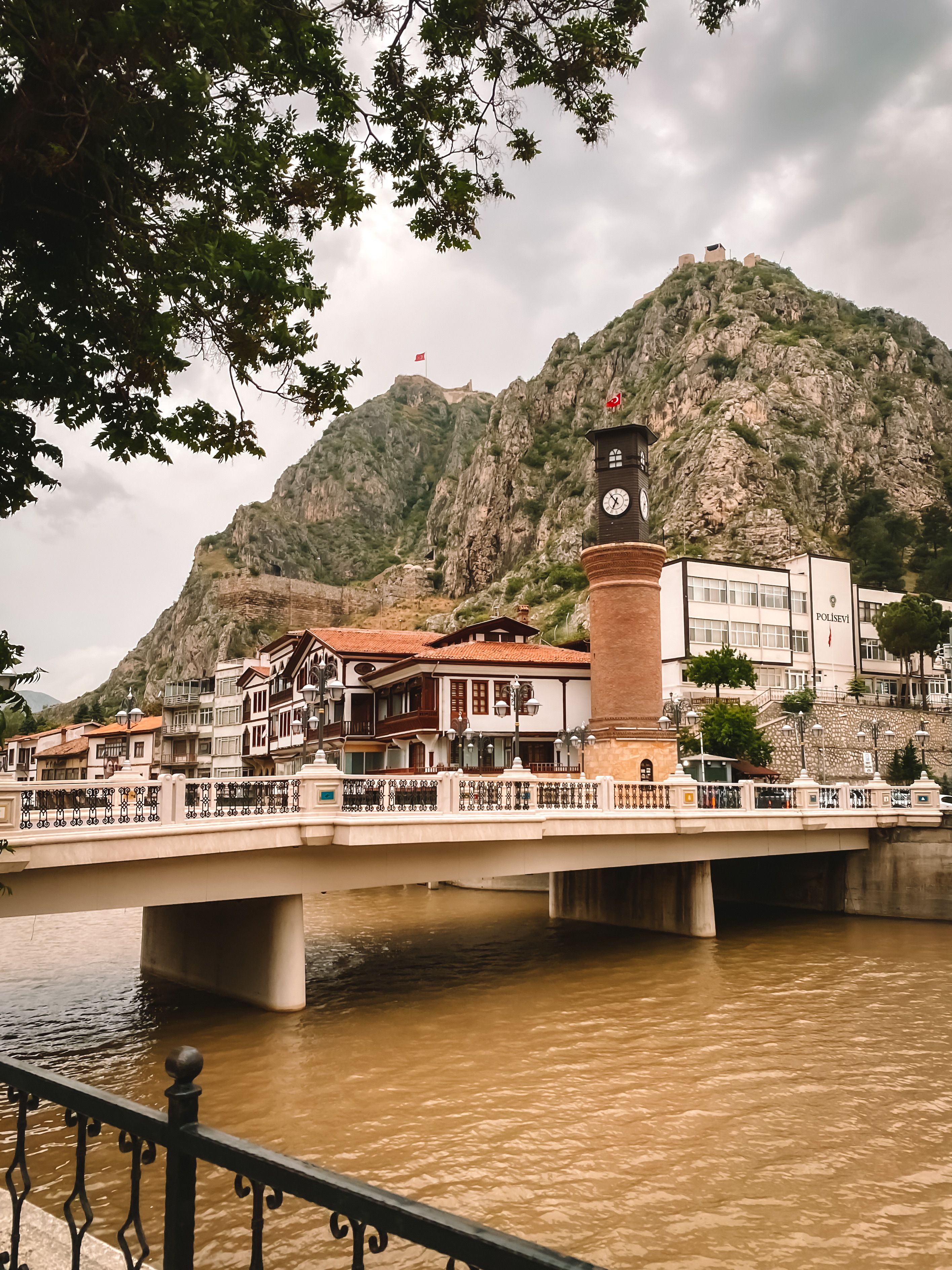 Panorama of a Beautiful Mountain Town with a River Bridge and Clock ...
