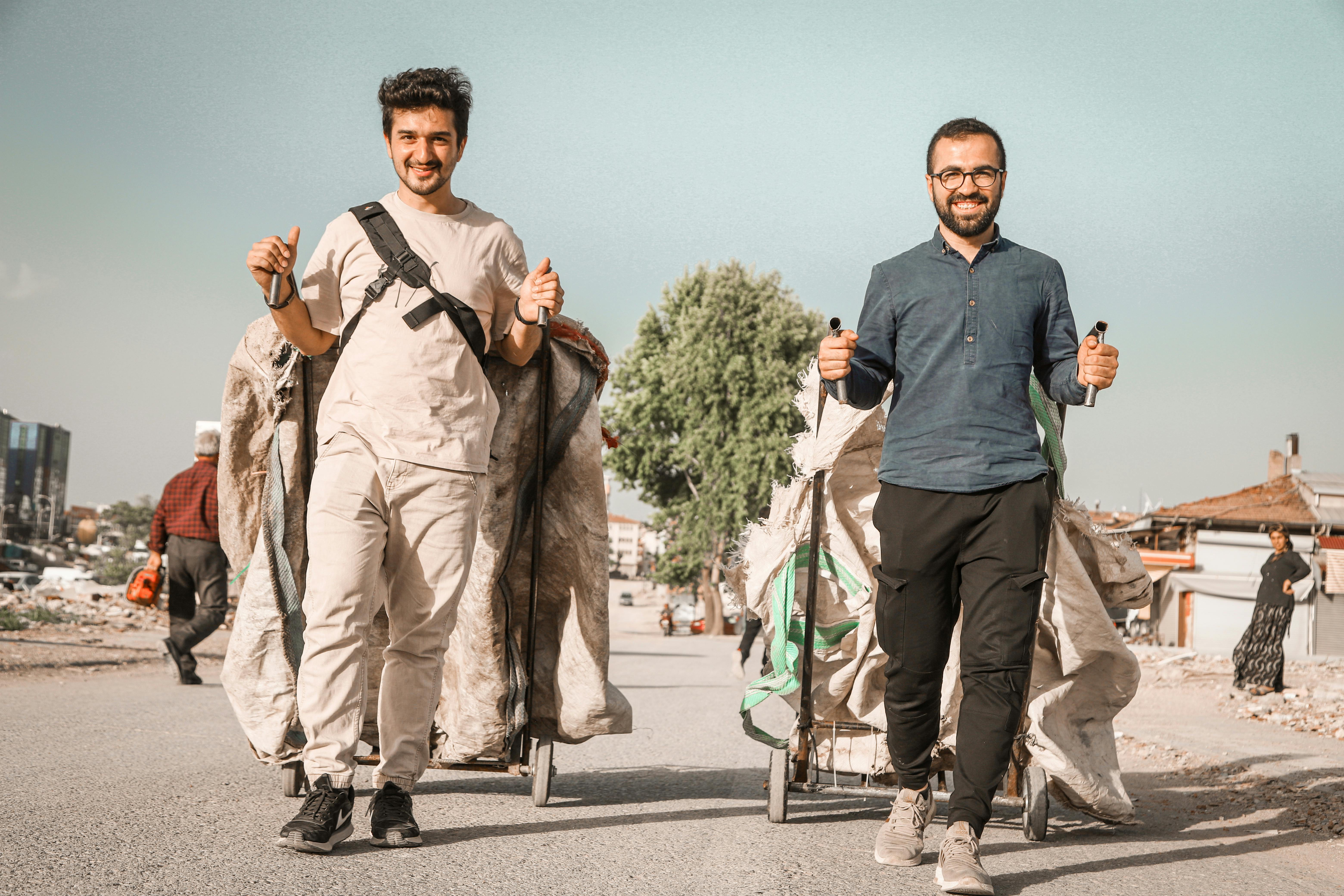 Men Pulling Hand Carts on Street · Free Stock Photo