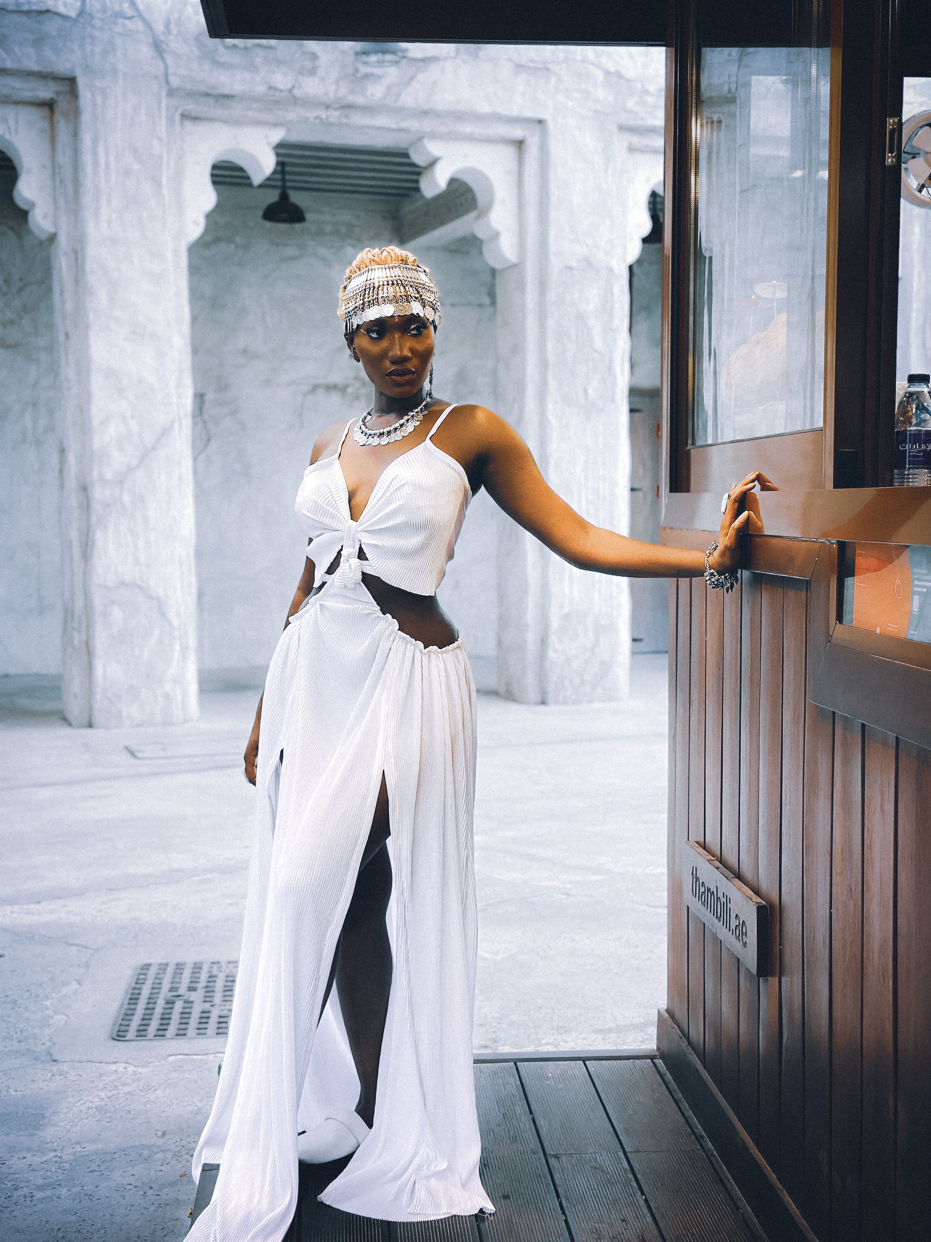 Woman in White Evening Dress Posing by Wooden Wall · Free Stock Photo
