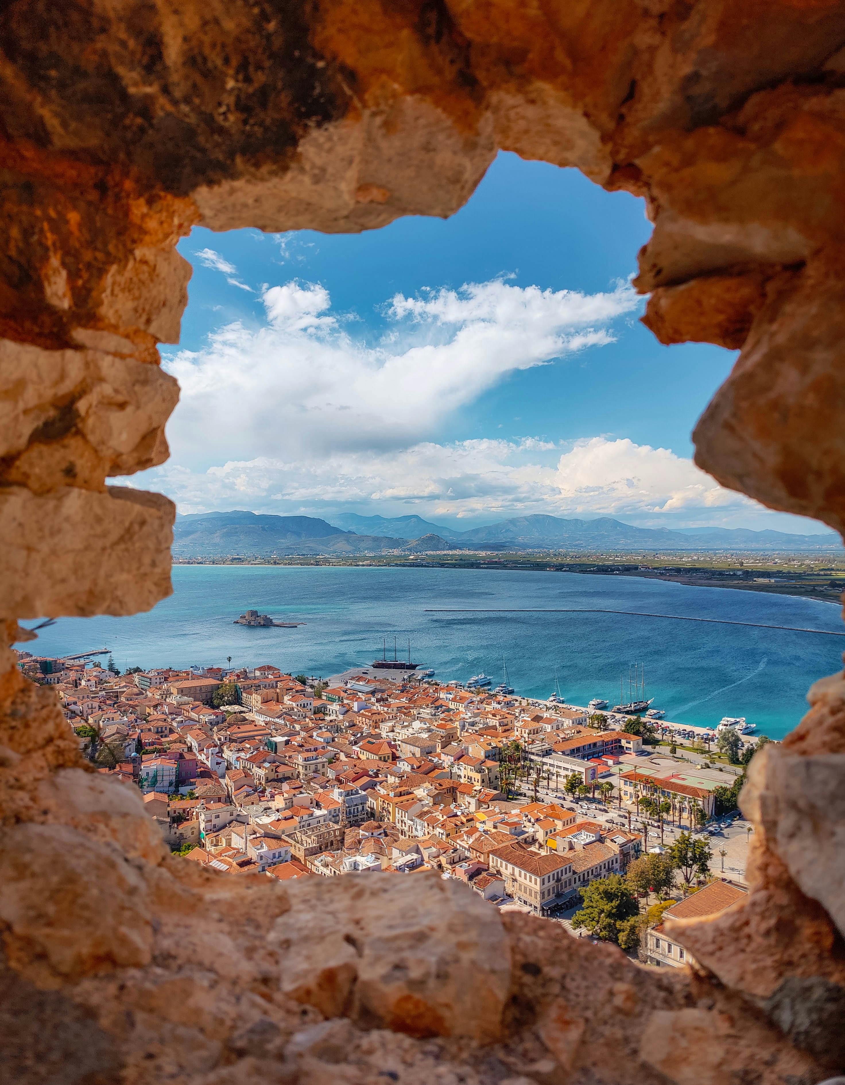 Seaside Town Seen through Window in Ruins · Free Stock Photo