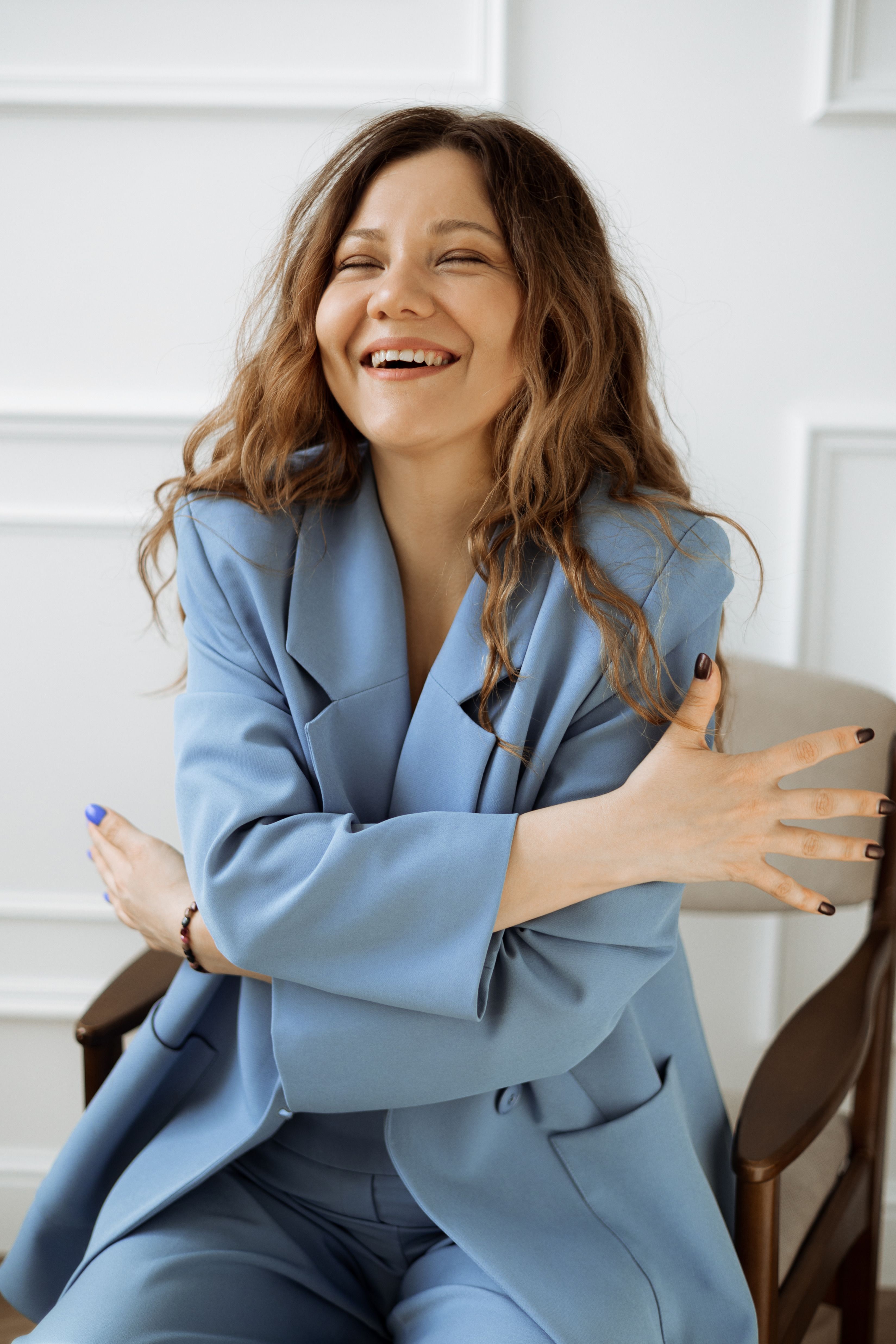 Happy Woman Posing in Blue Suit · Free Stock Photo
