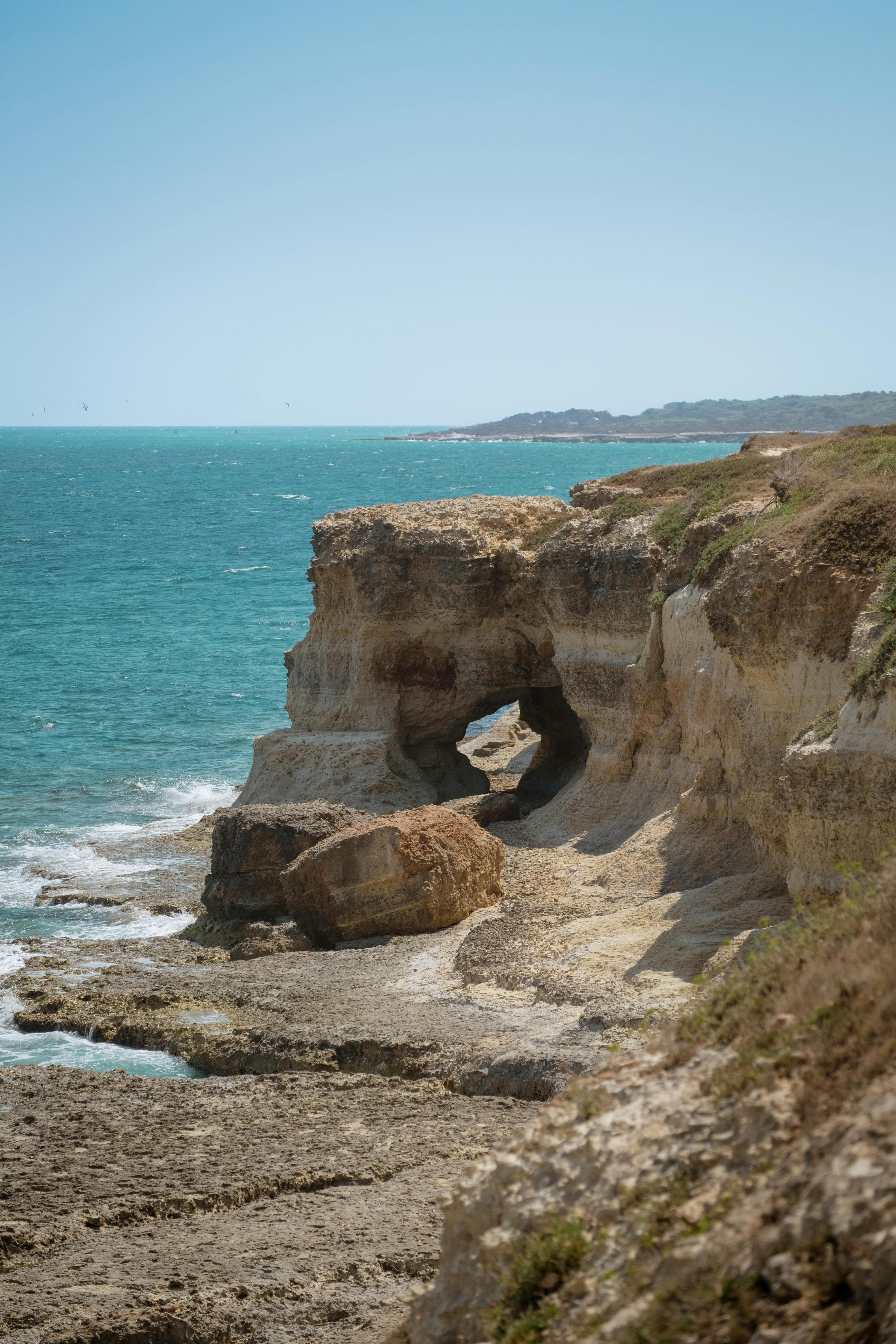 Cliff and Rocks on Sea Shore · Free Stock Photo