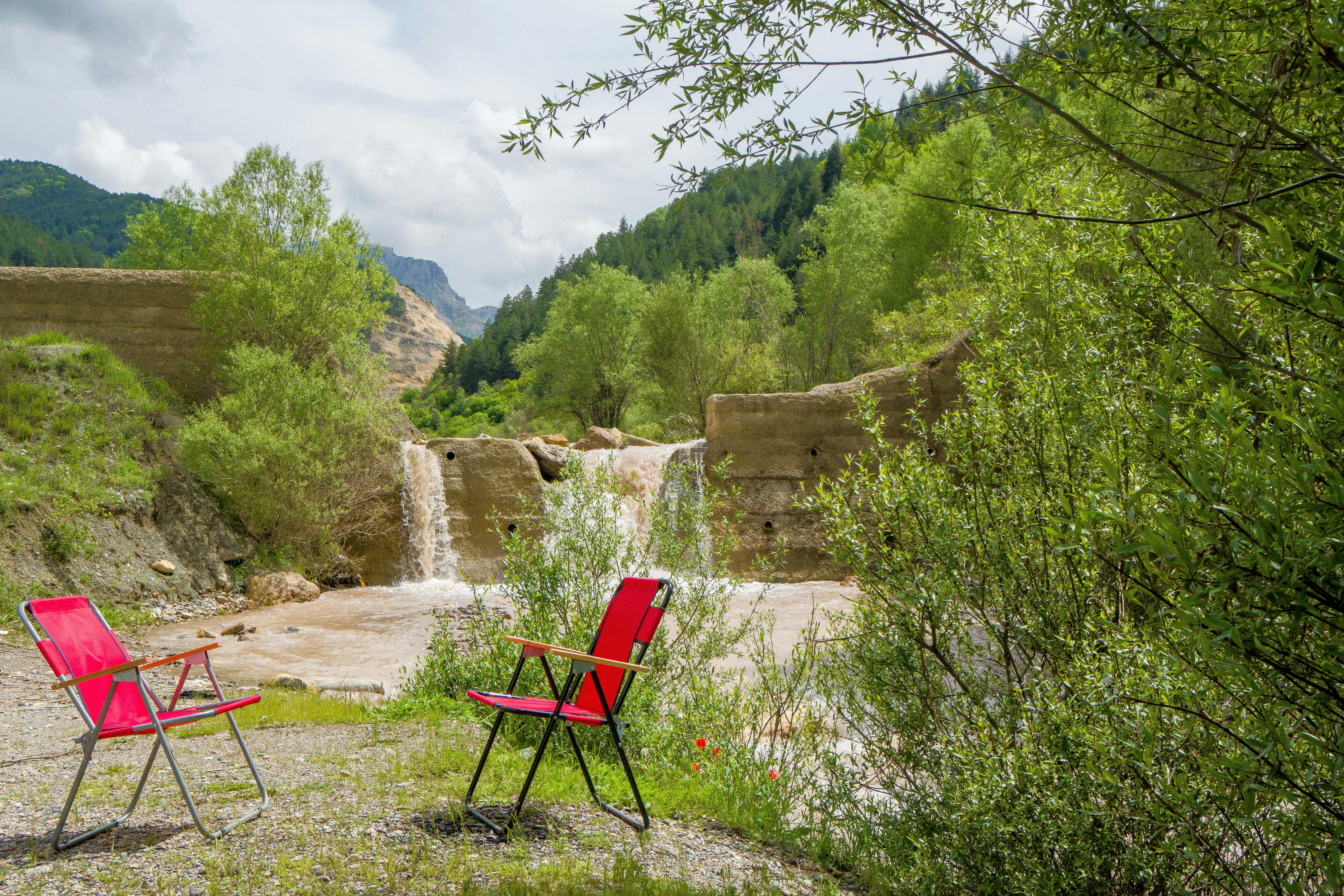 Chairs near Stream and Waterfall · Free Stock Photo