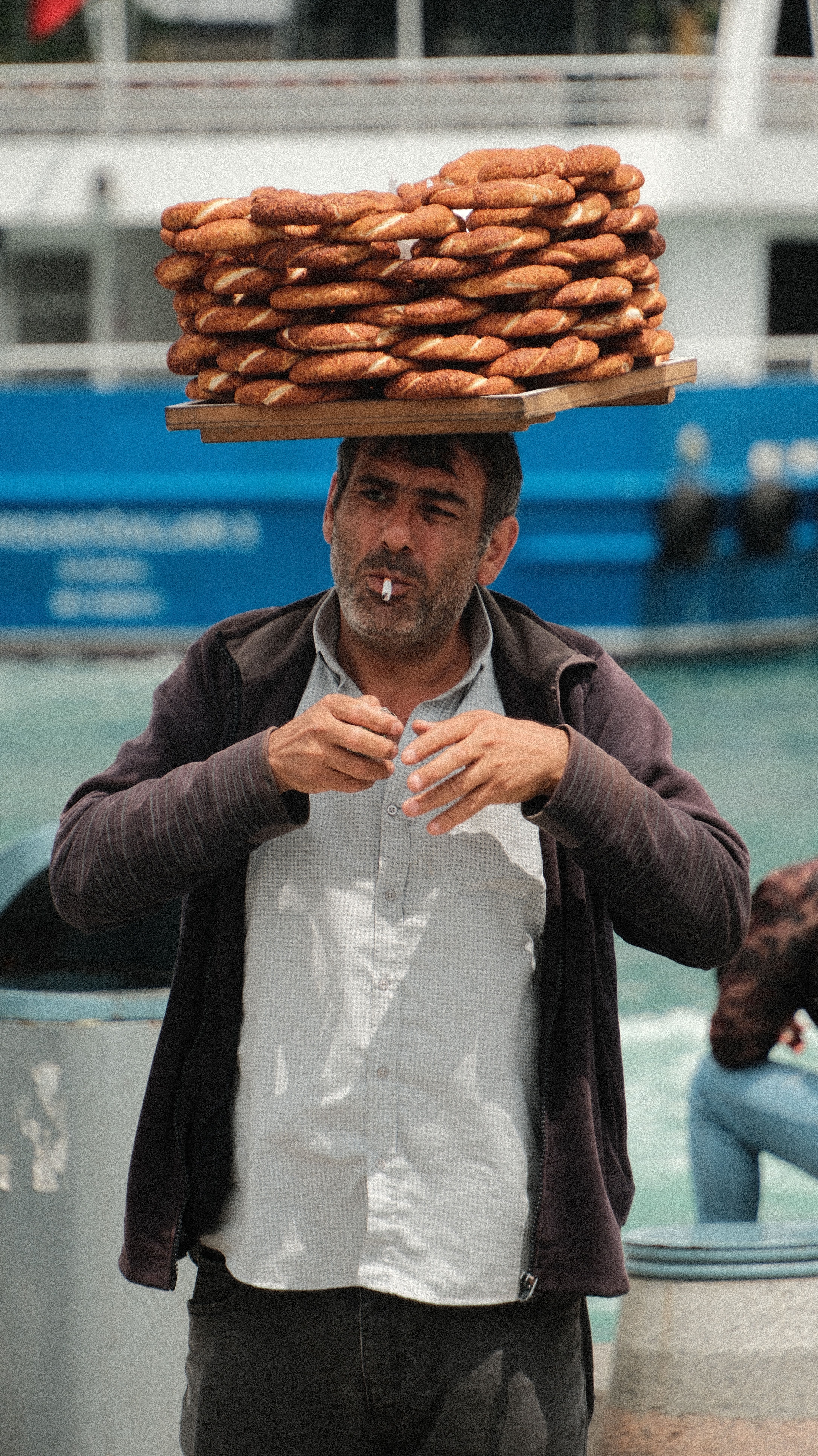 Seller with Bagels on Head · Free Stock Photo