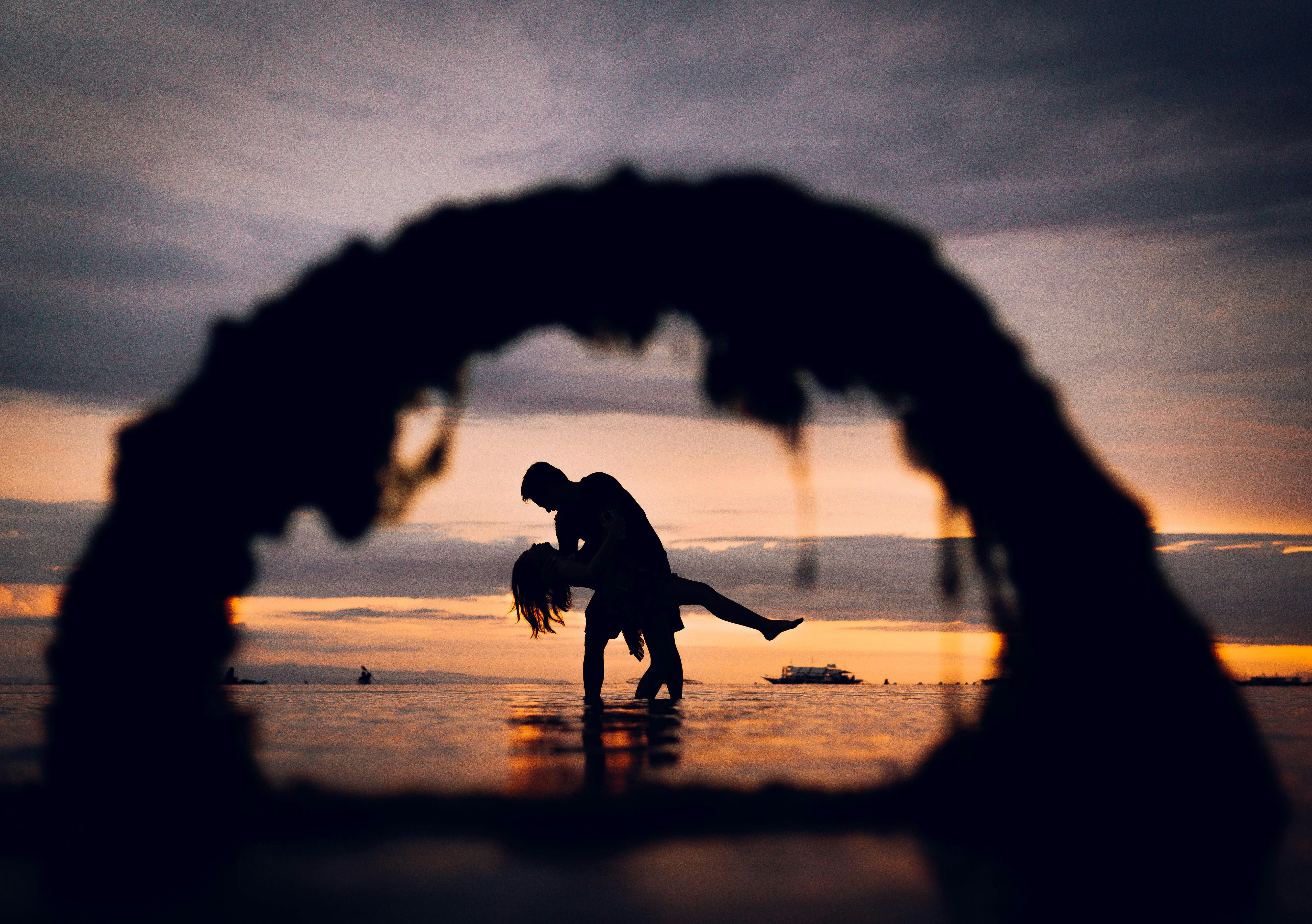 Silhouette of a Couple on a Beach · Free Stock Photo