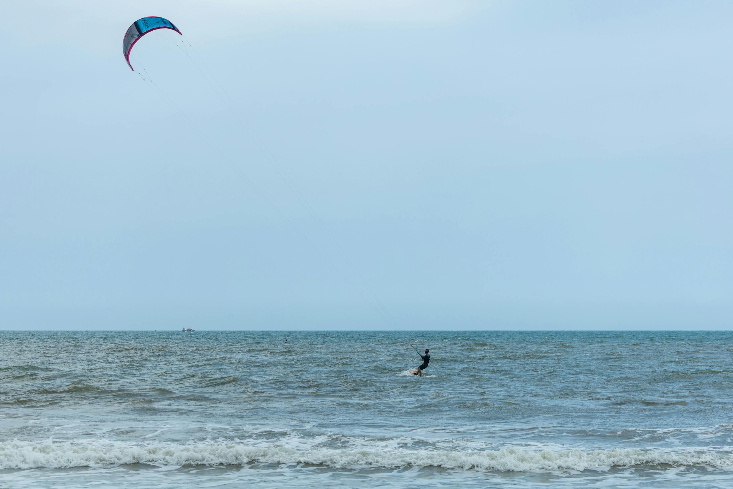 Man Holding to a Power Kite · Free Stock Photo