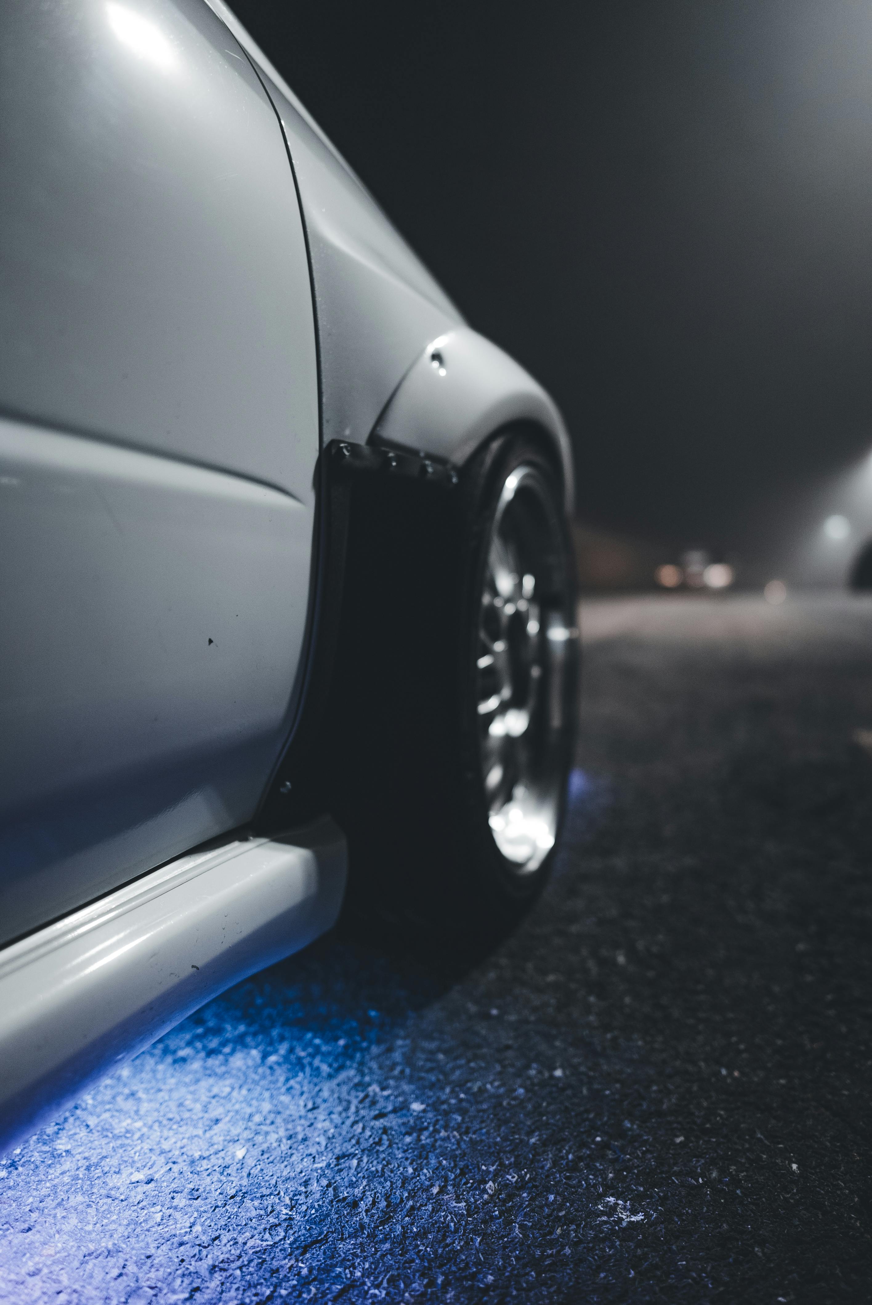 Side and Front Wheel of a Modified Street Racing Car · Free Stock Photo