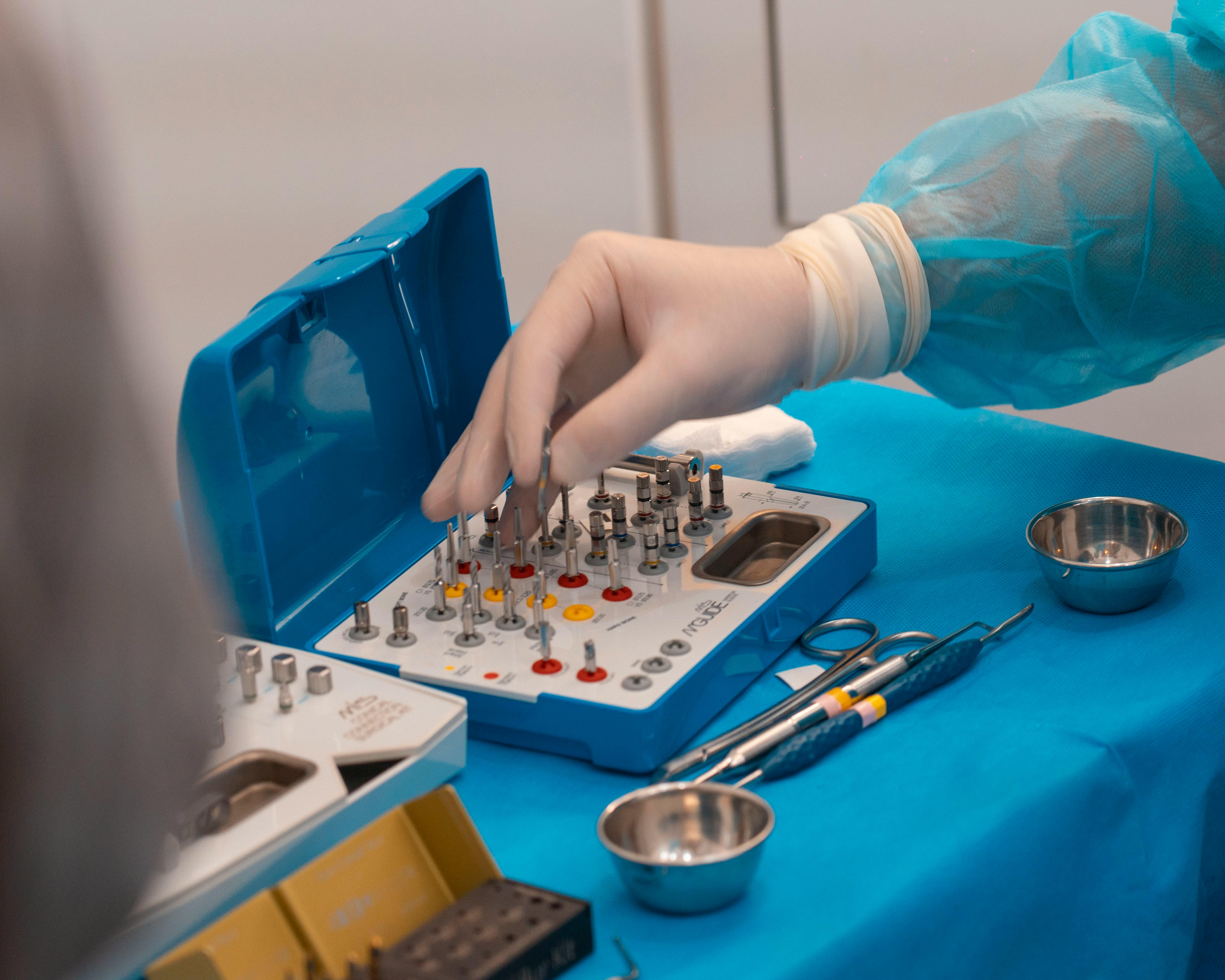 Hand in Glove over Medical Device · Free Stock Photo