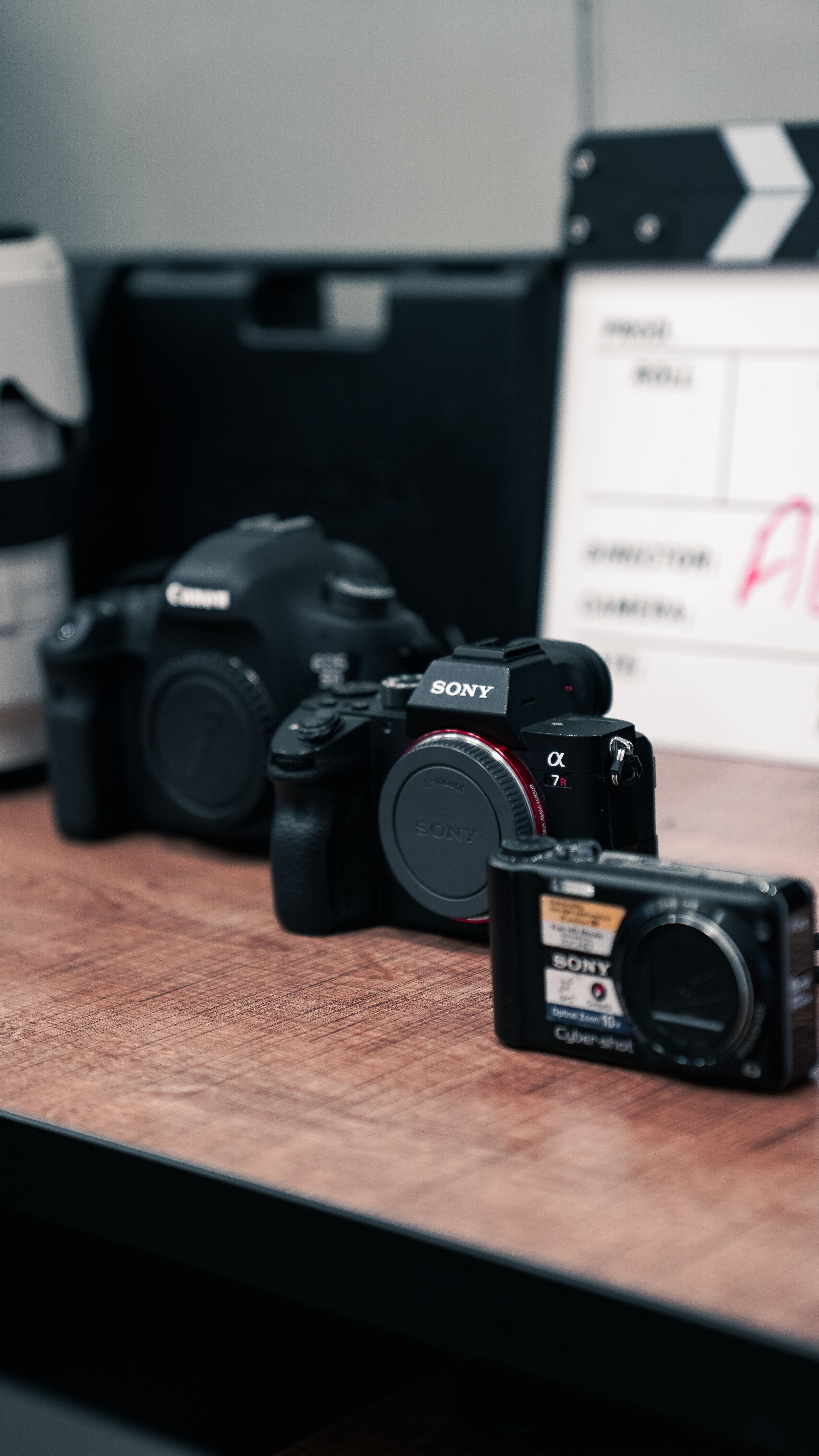 Cameras in Row on Table · Free Stock Photo