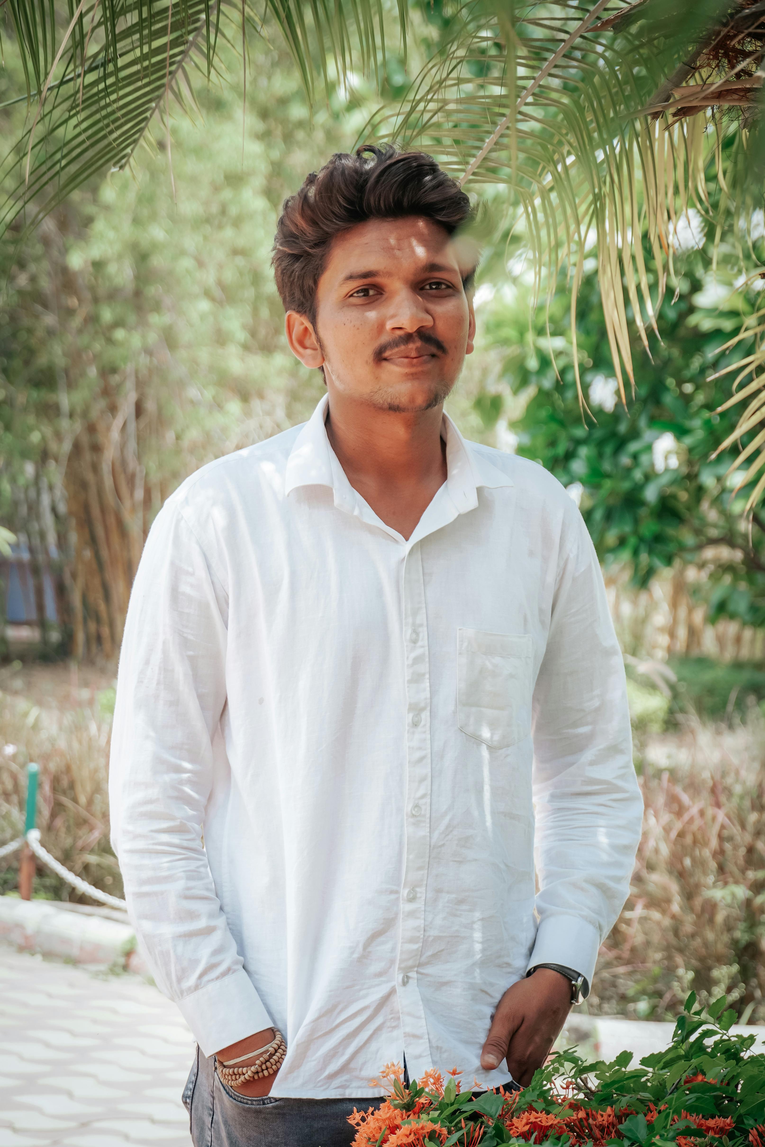 Shy Man Posing in Casual Clothing · Free Stock Photo