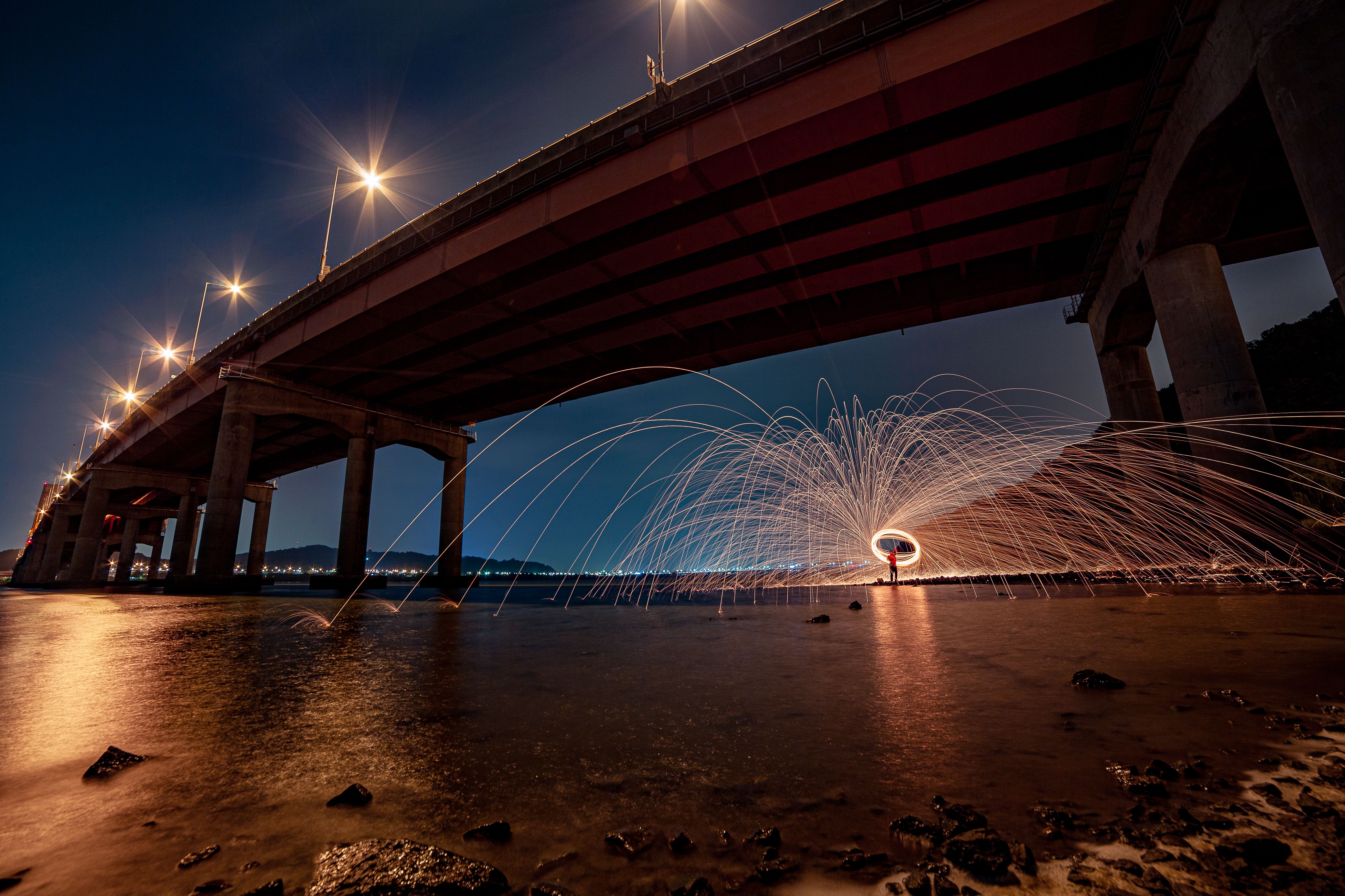 Spinning Steel Wool under Bridge · Free Stock Photo