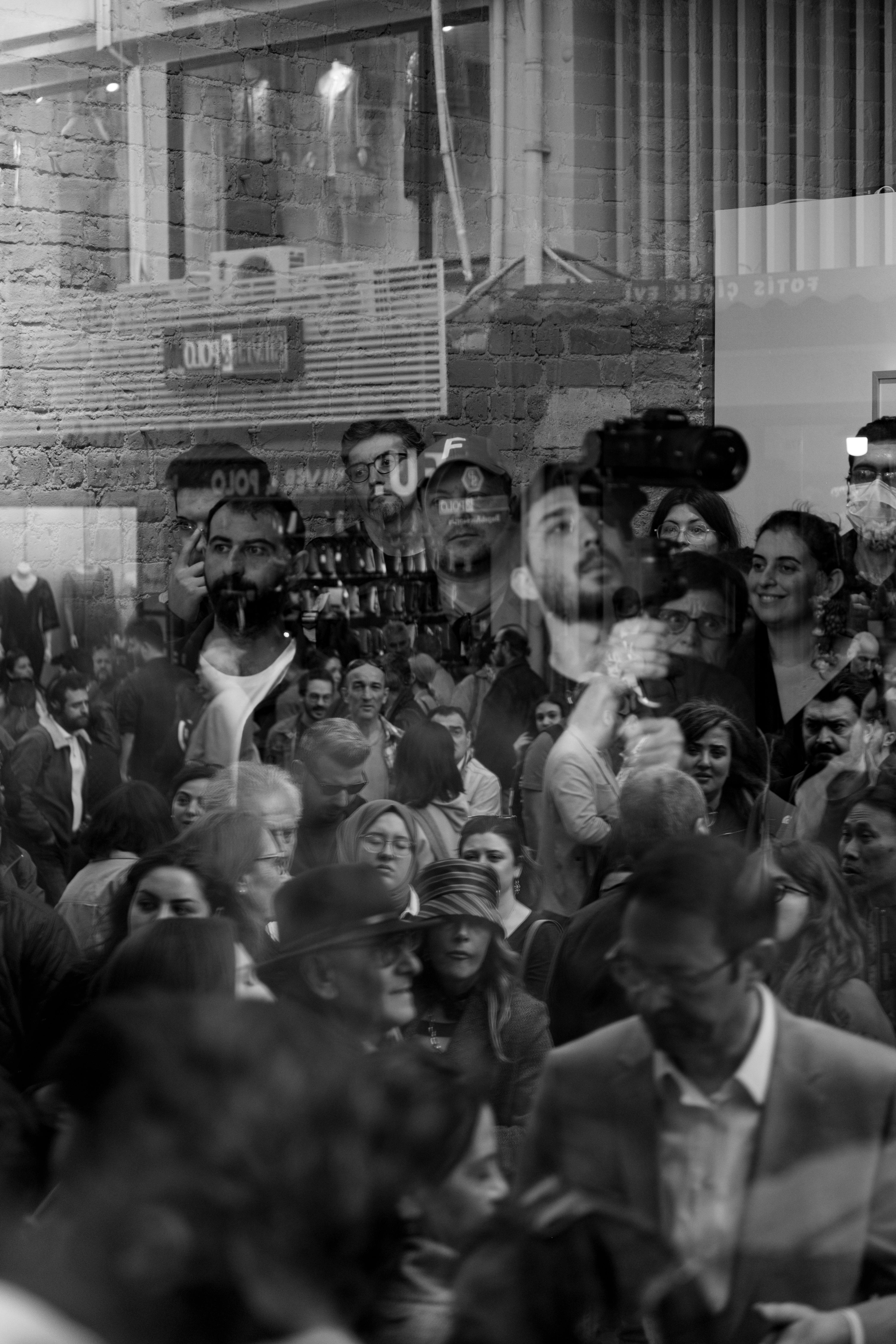 People behind Window in Black and White · Free Stock Photo