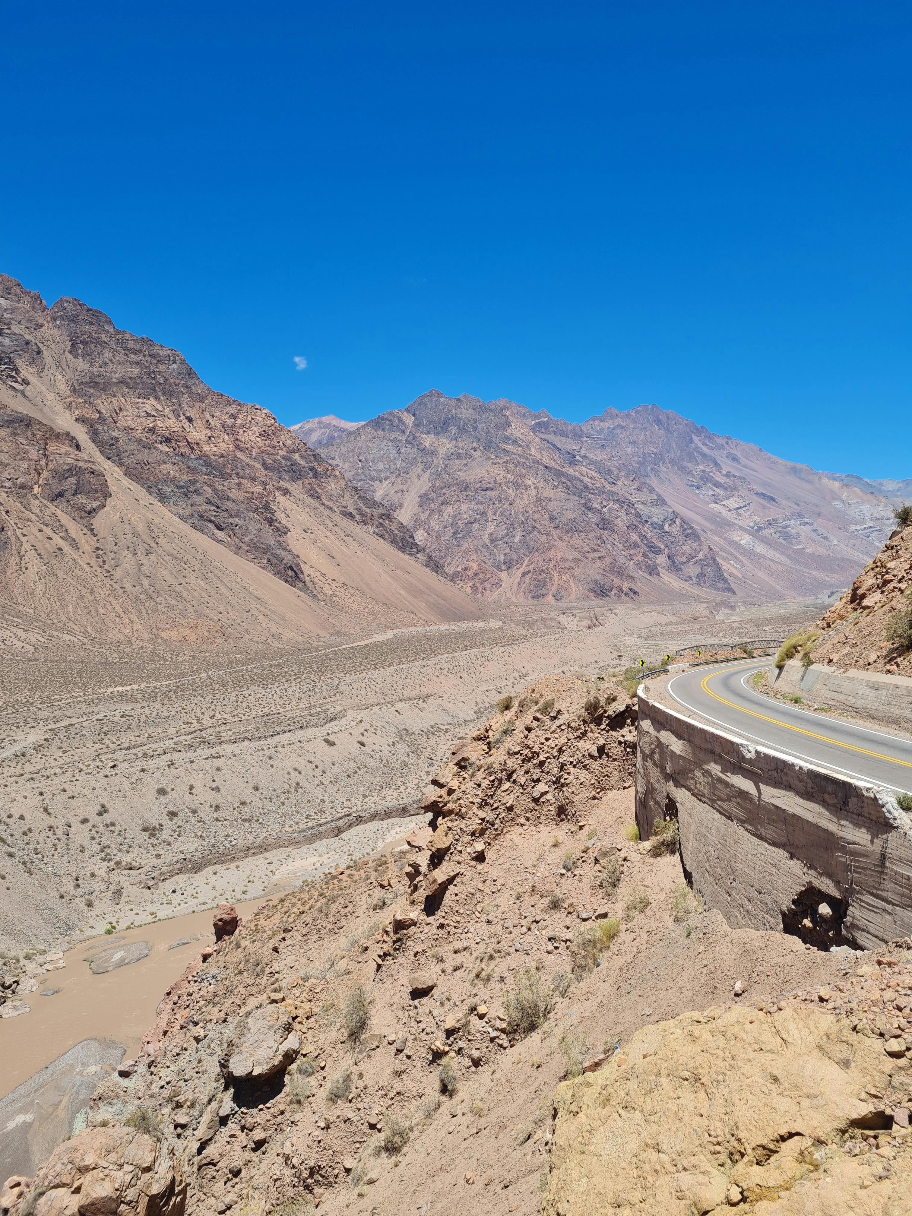 Arid Valley with a Highway in the Foreground · Free Stock Photo