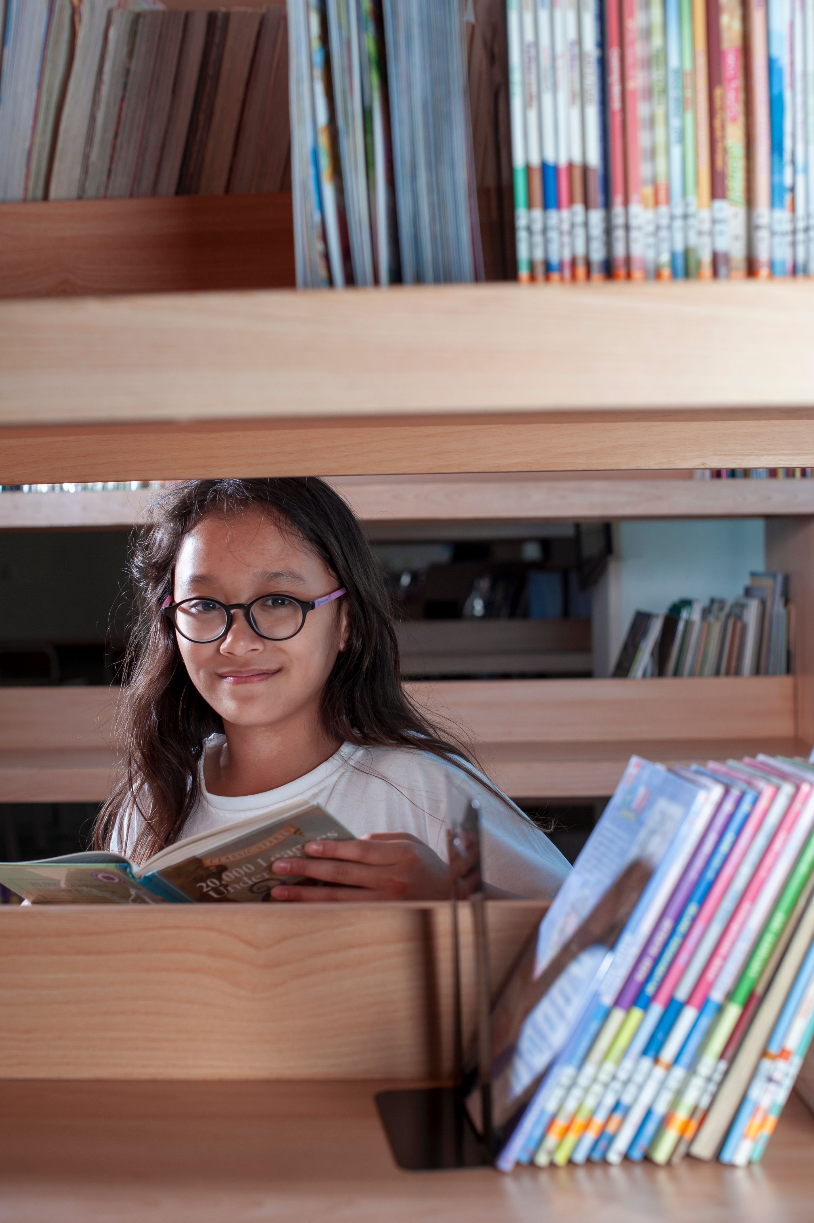 A Girl in a Library · Free Stock Photo