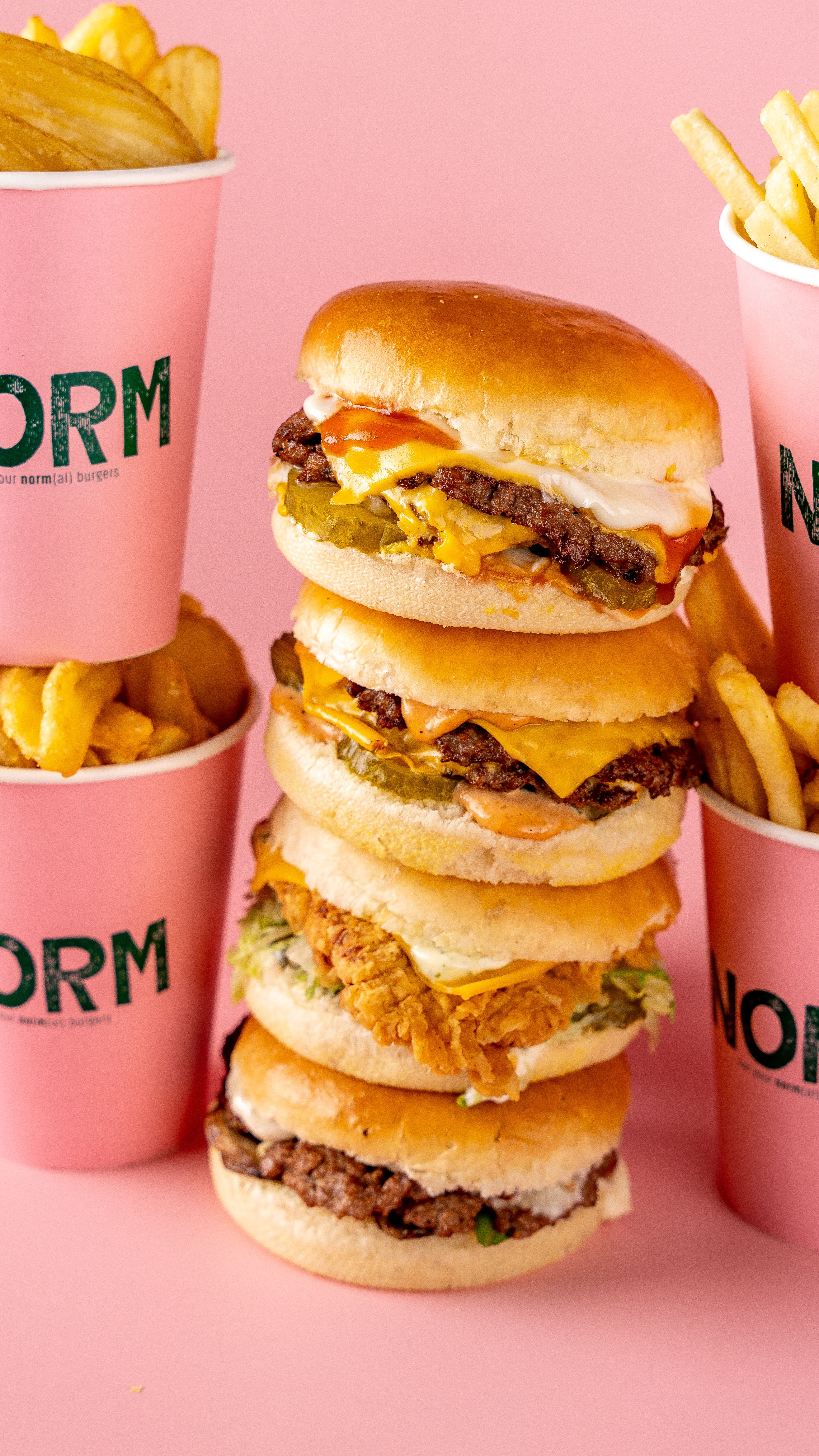 Stack of Cheeseburgers and Cups of French Fries and Chicken Fingers ...