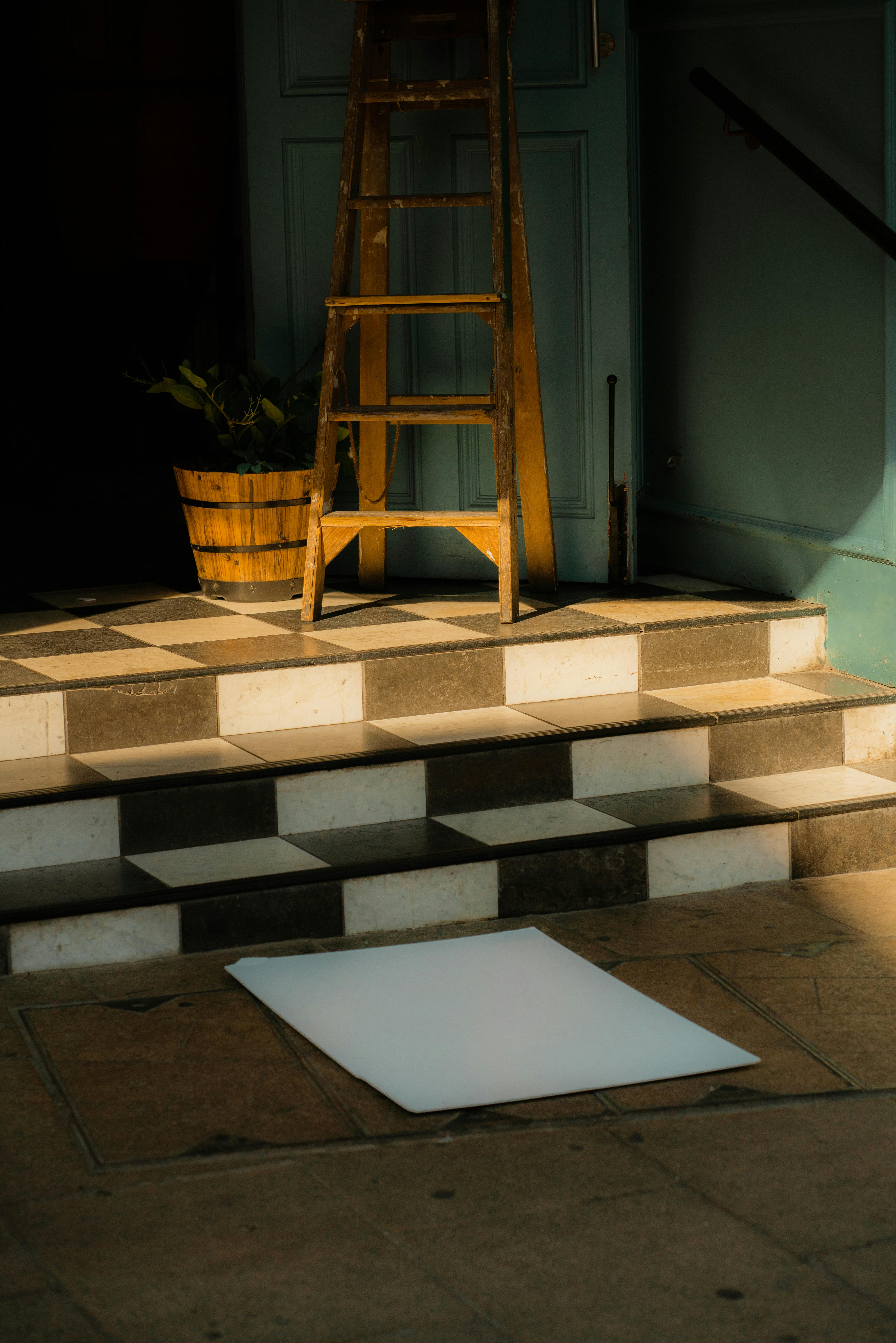 Checkered Tiles on the Steps Outside of a Building · Free Stock Photo