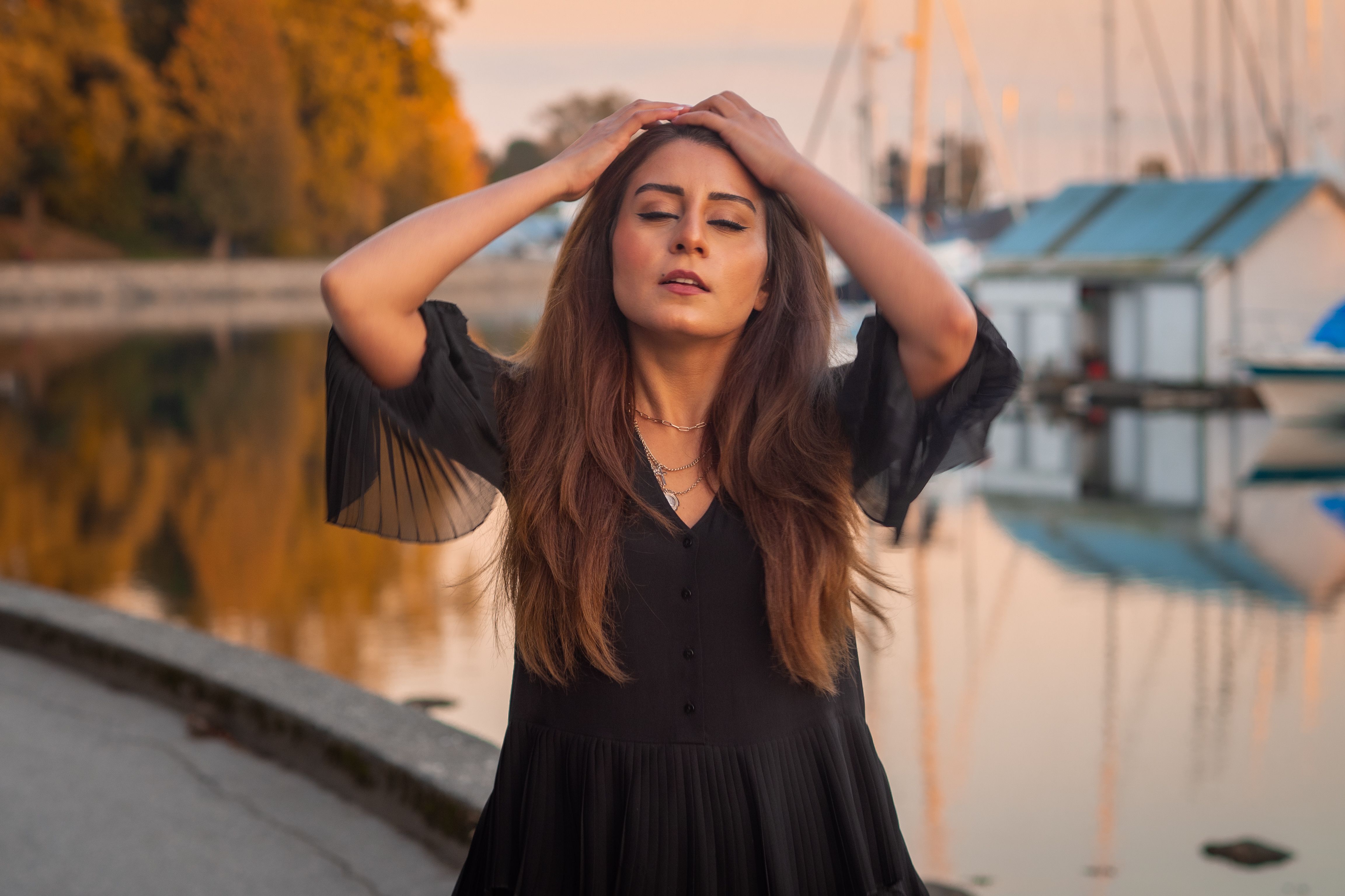 Woman Posing with Hands on Head · Free Stock Photo
