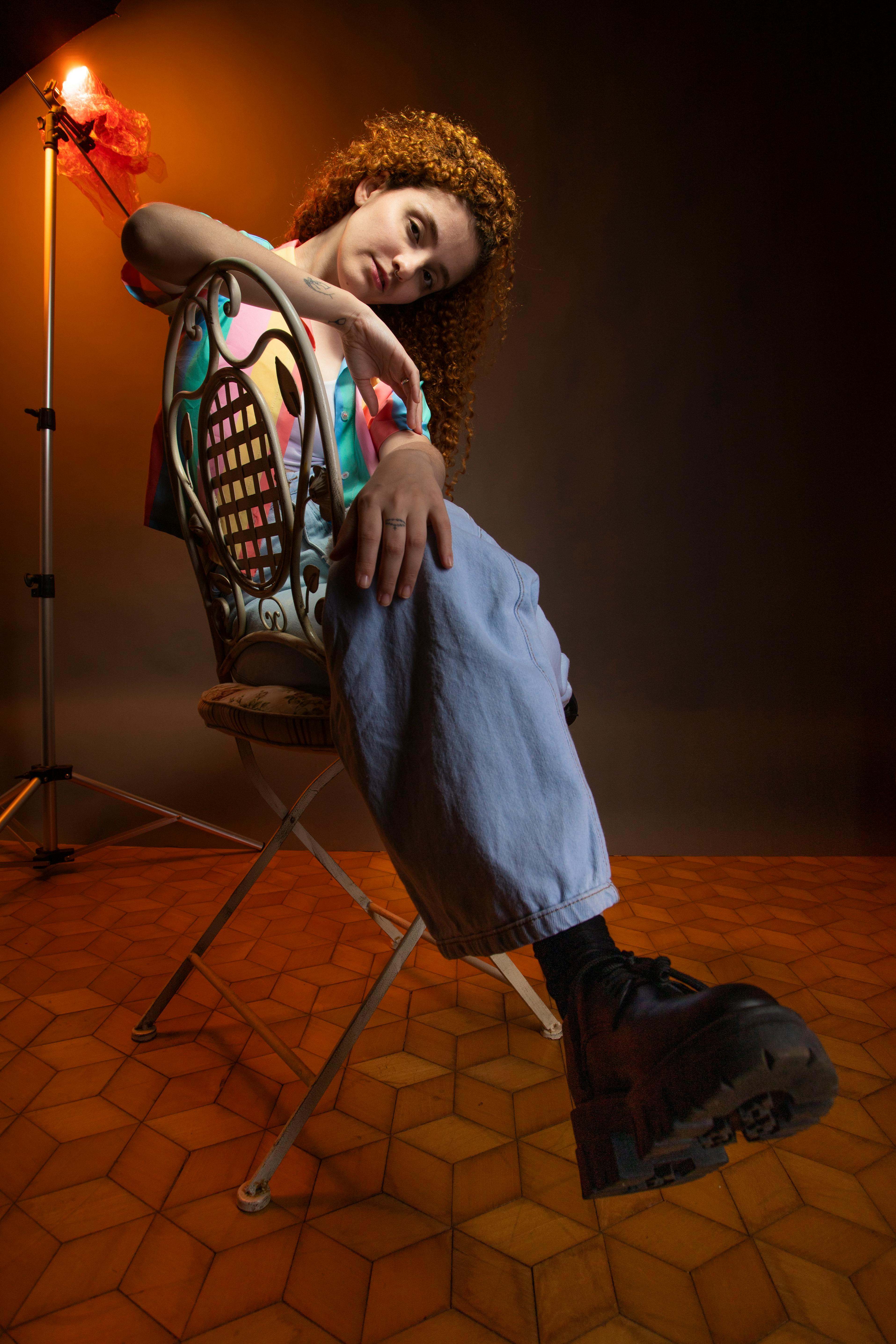 Model Sitting on Chair · Free Stock Photo