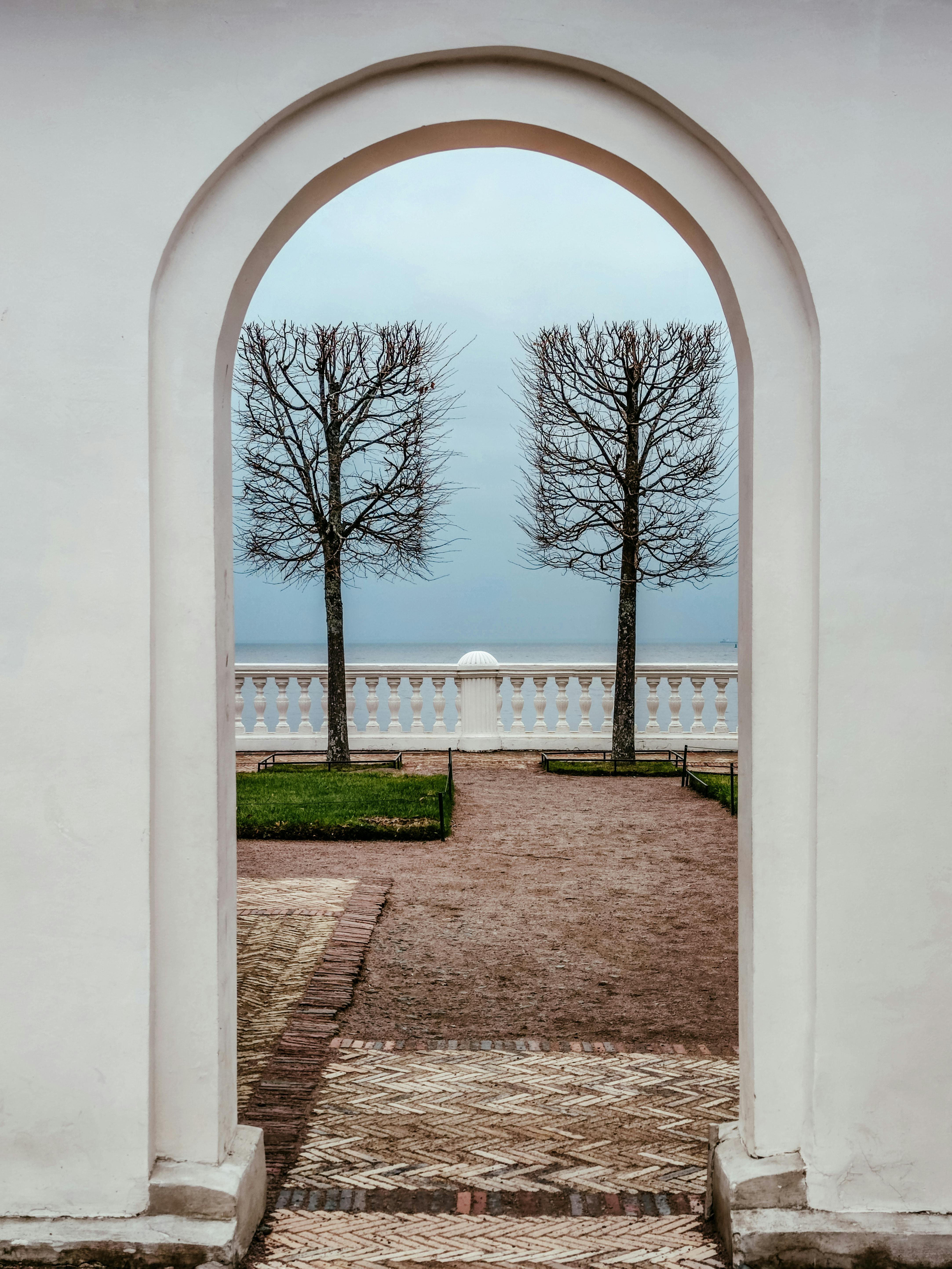 Garden Seen through Arched Entrance · Free Stock Photo