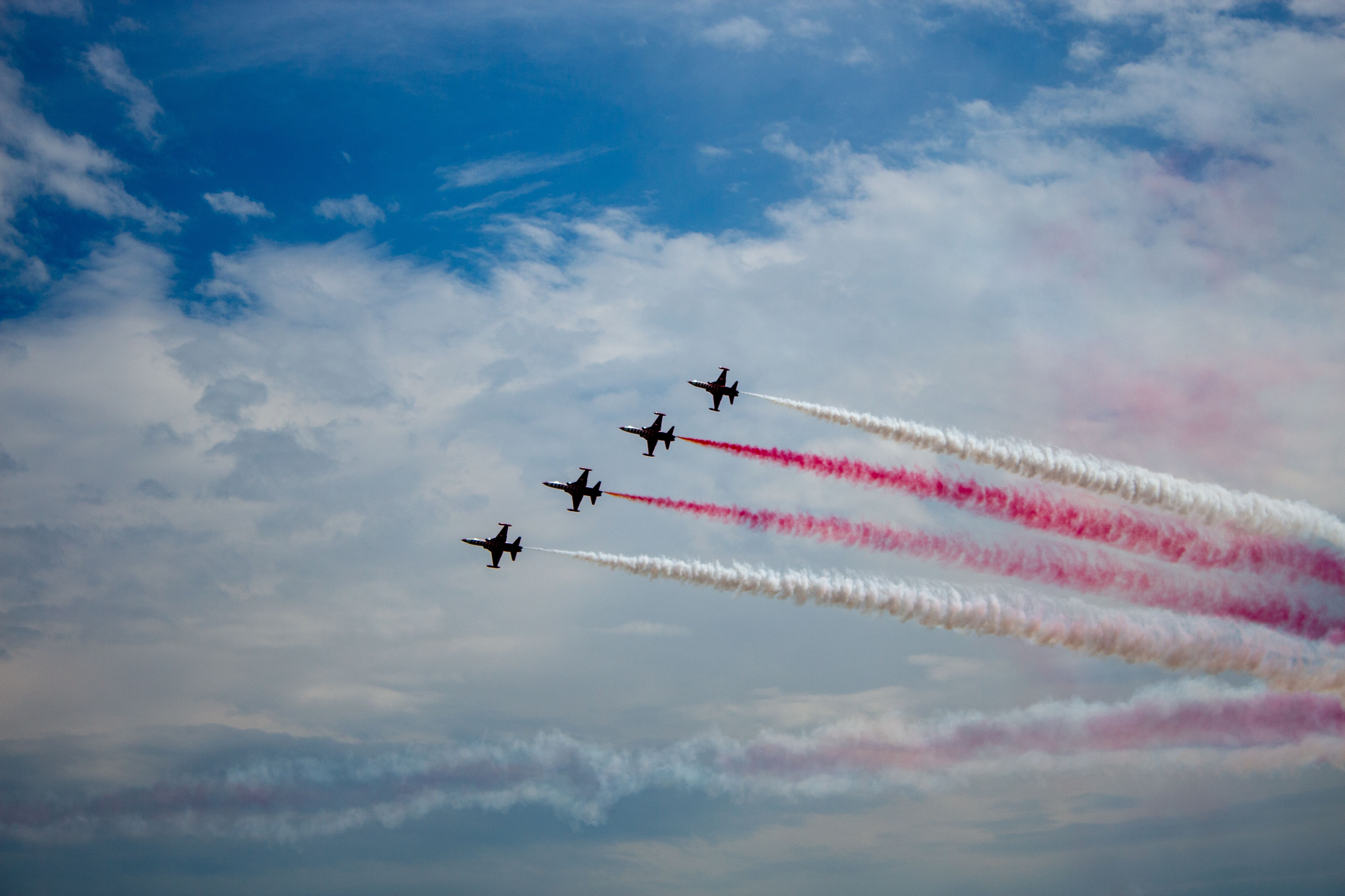 Jets Flying against Cloudy Sky Leaving Colorful Smoke Trails · Free ...