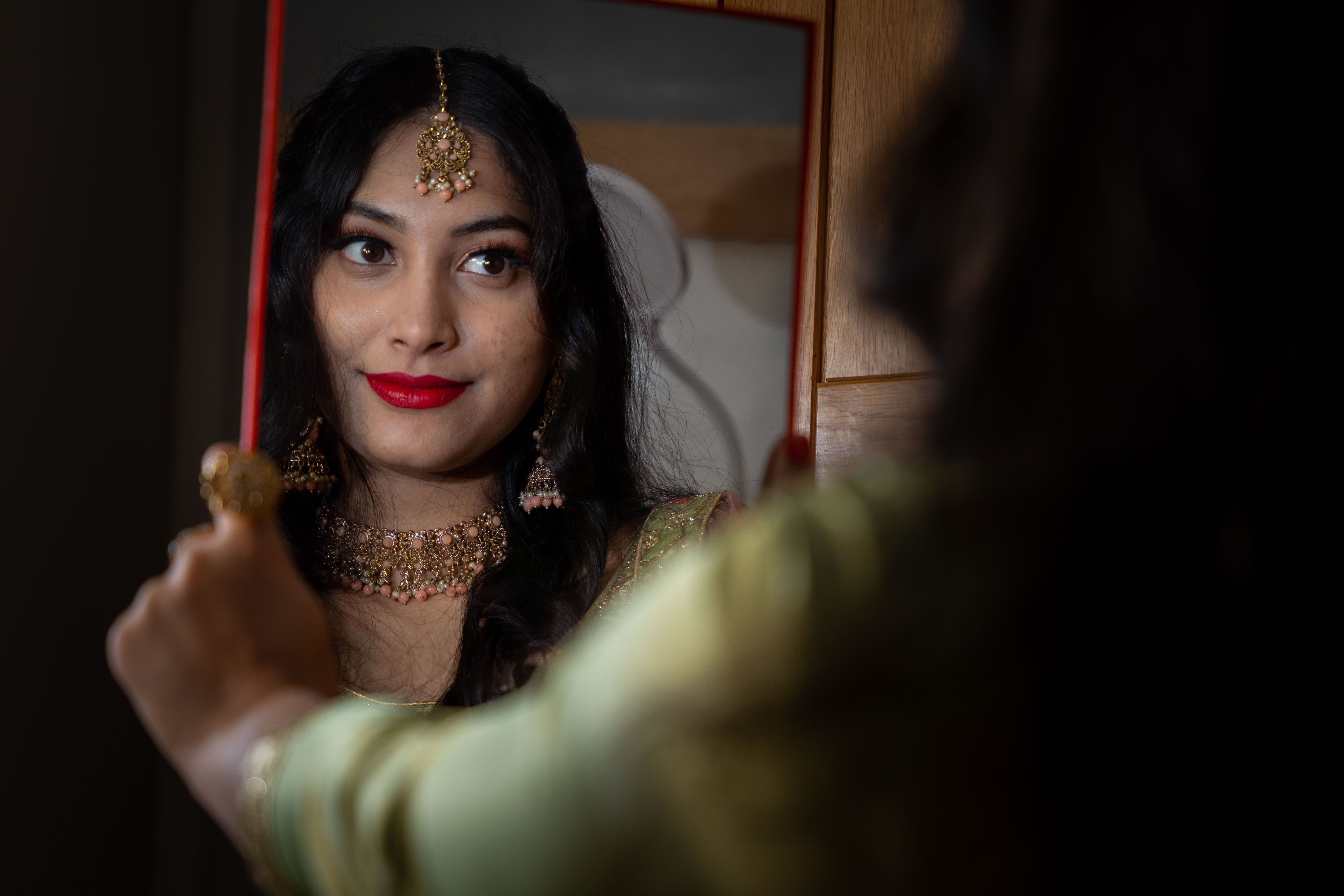 Woman with Golden Jewelry Reflection in Mirror · Free Stock Photo