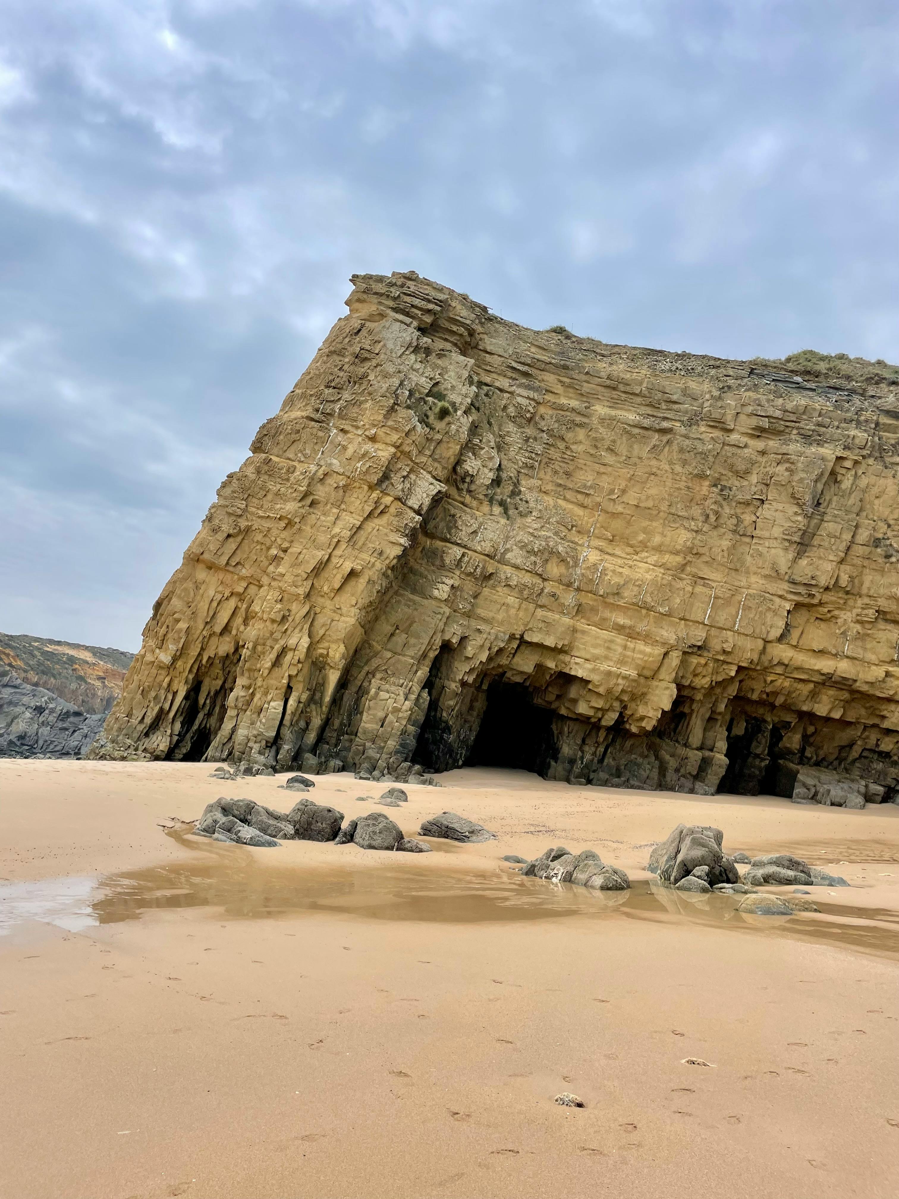 Photo of a Rocky Cliff Near the Ocean · Free Stock Photo