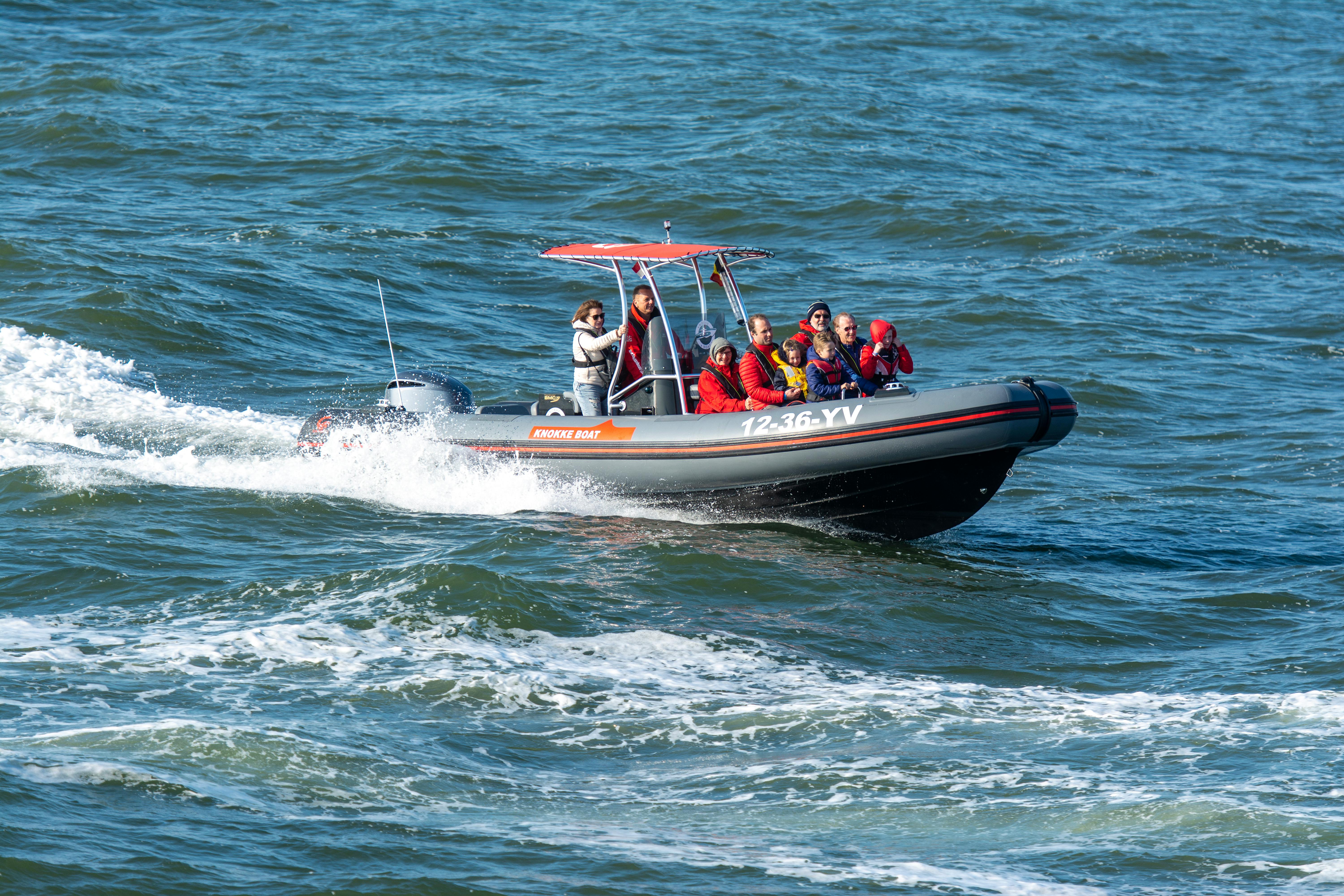 Group of People Riding in an Inflatable Boat · Free Stock Photo