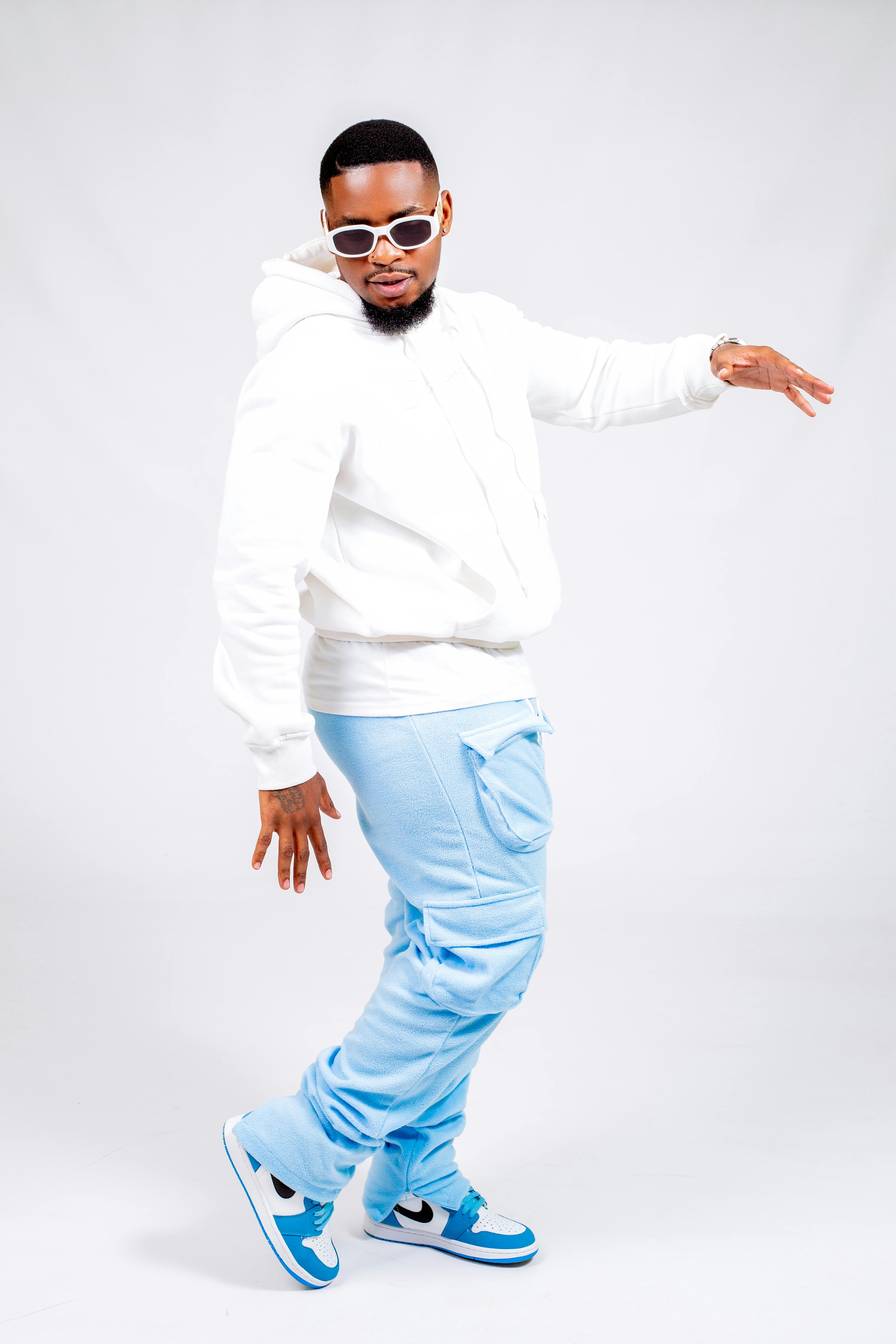 Photo of a Man Wearing a Tracksuit and Sunglasses · Free Stock Photo