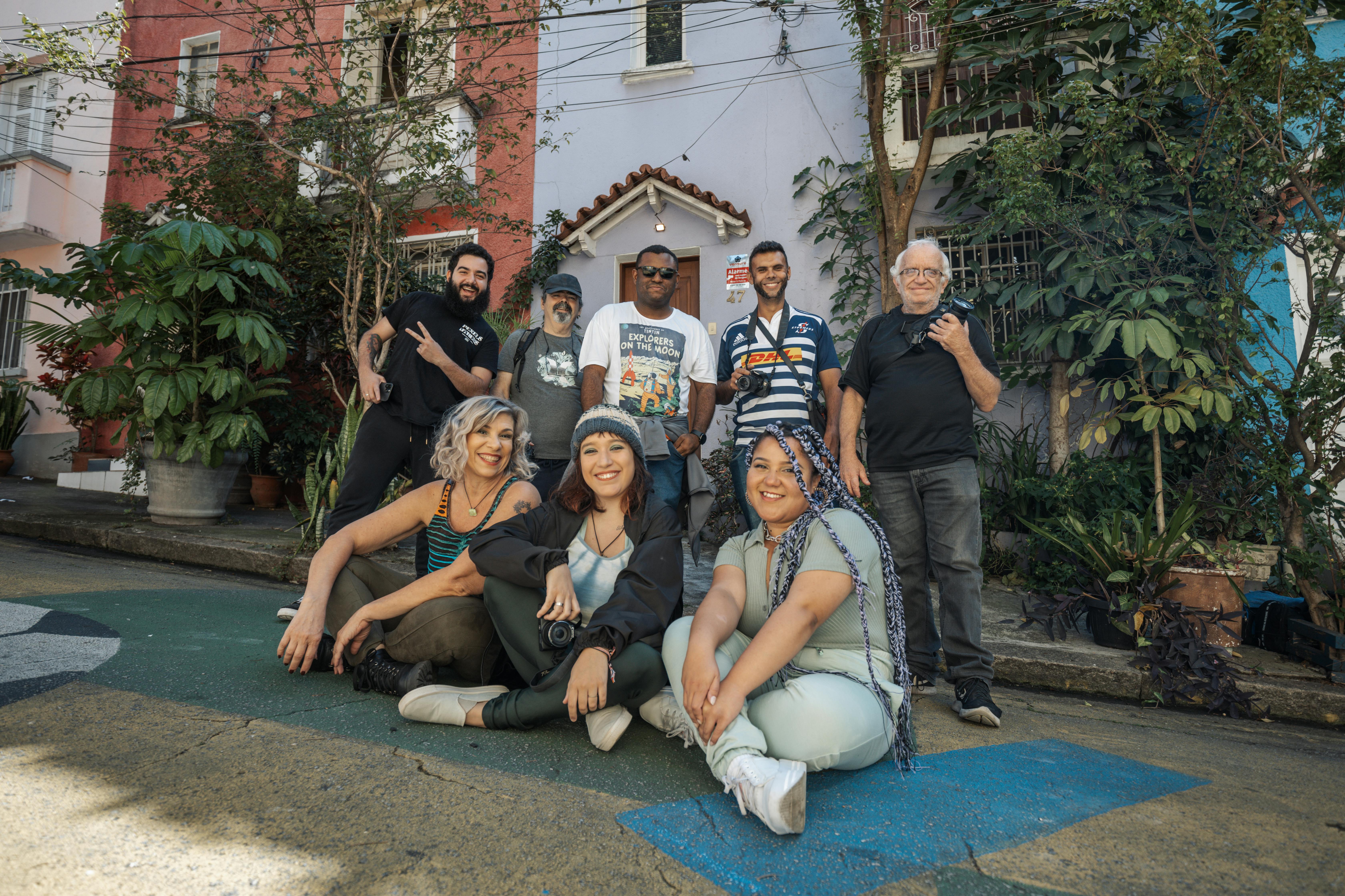 A Group of Photographers Posing on a City Street · Free Stock Photo