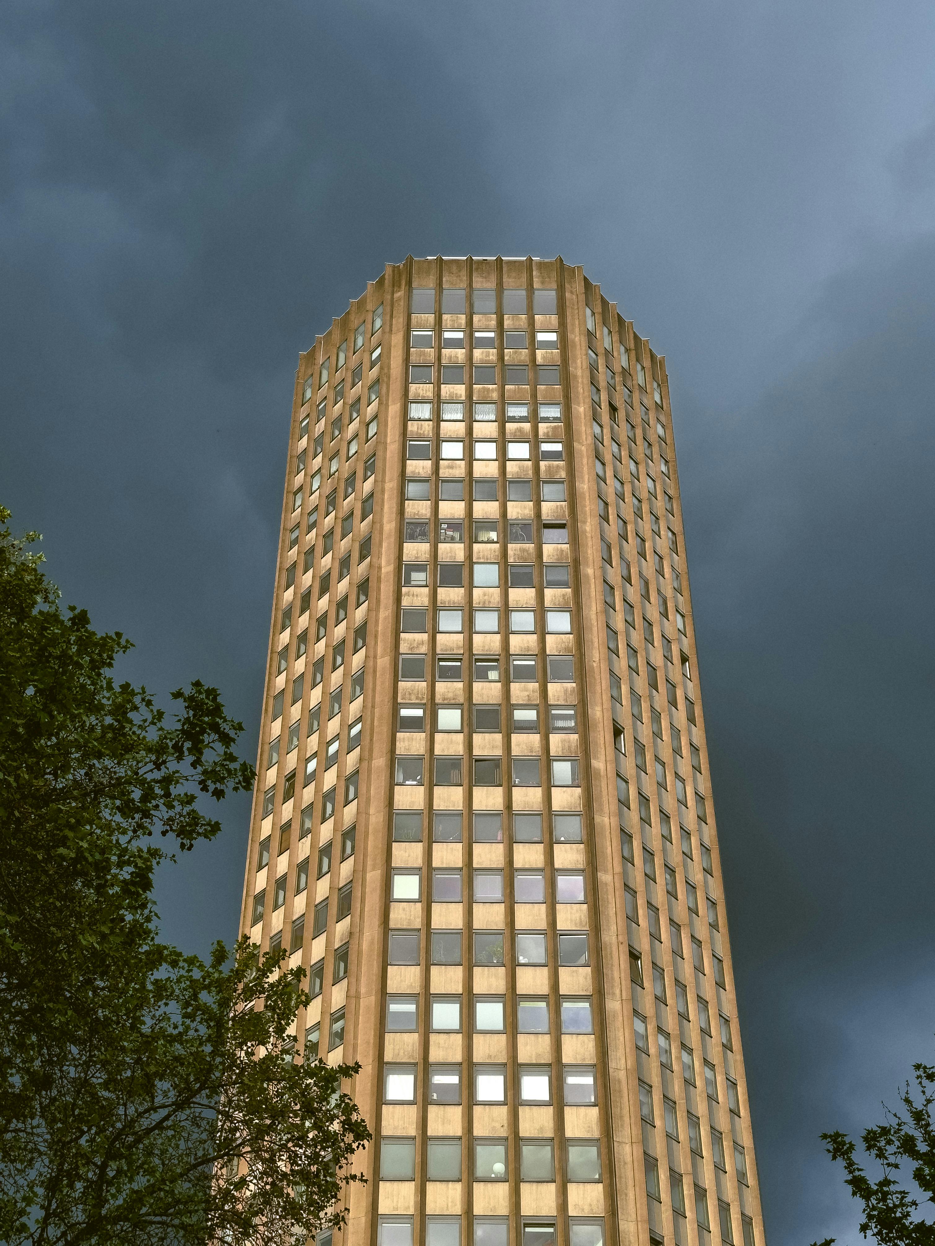 Hexagonal Skyscraper against Storm Clouds · Free Stock Photo