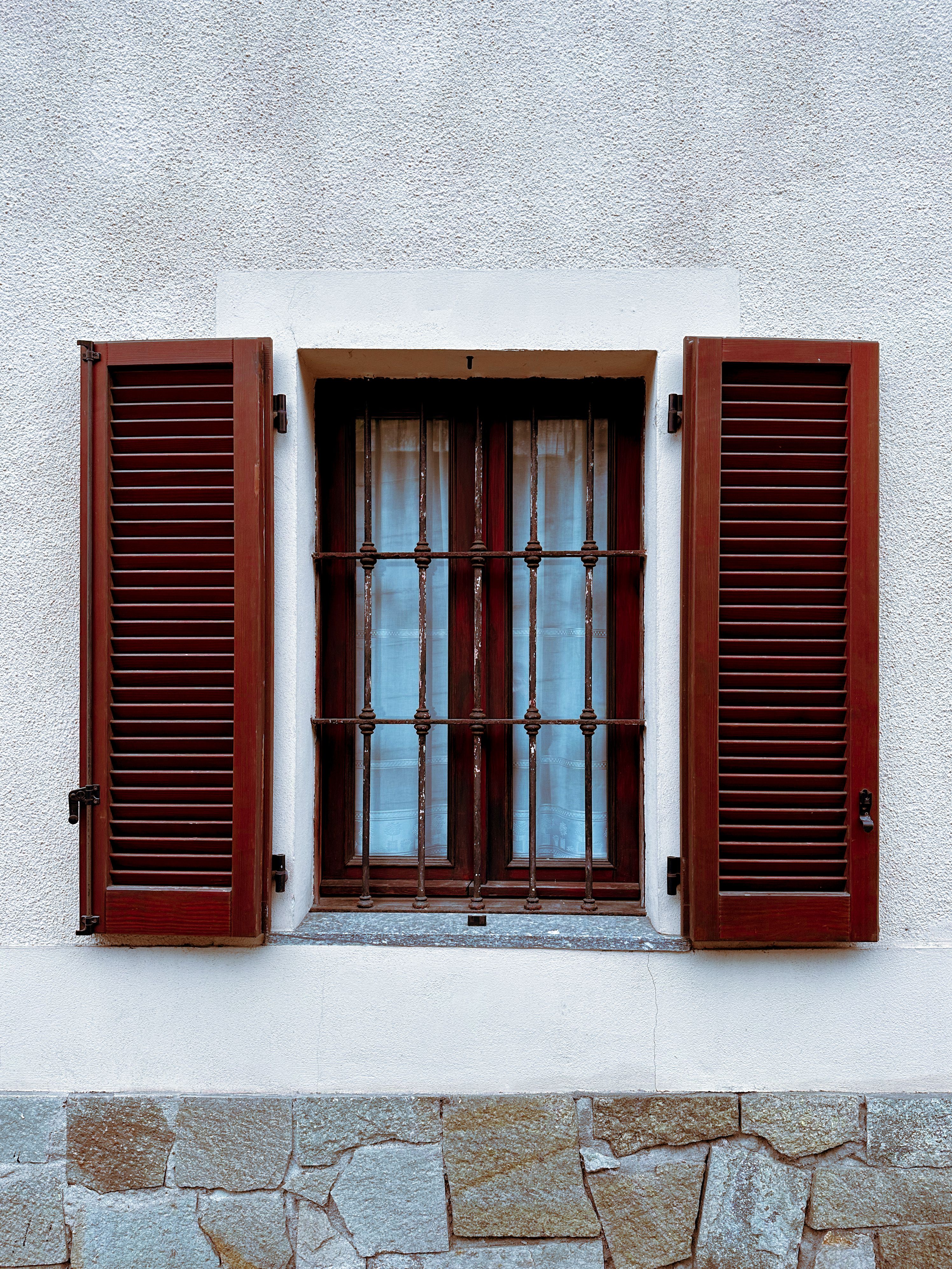 Shutters and Bars on Windows · Free Stock Photo