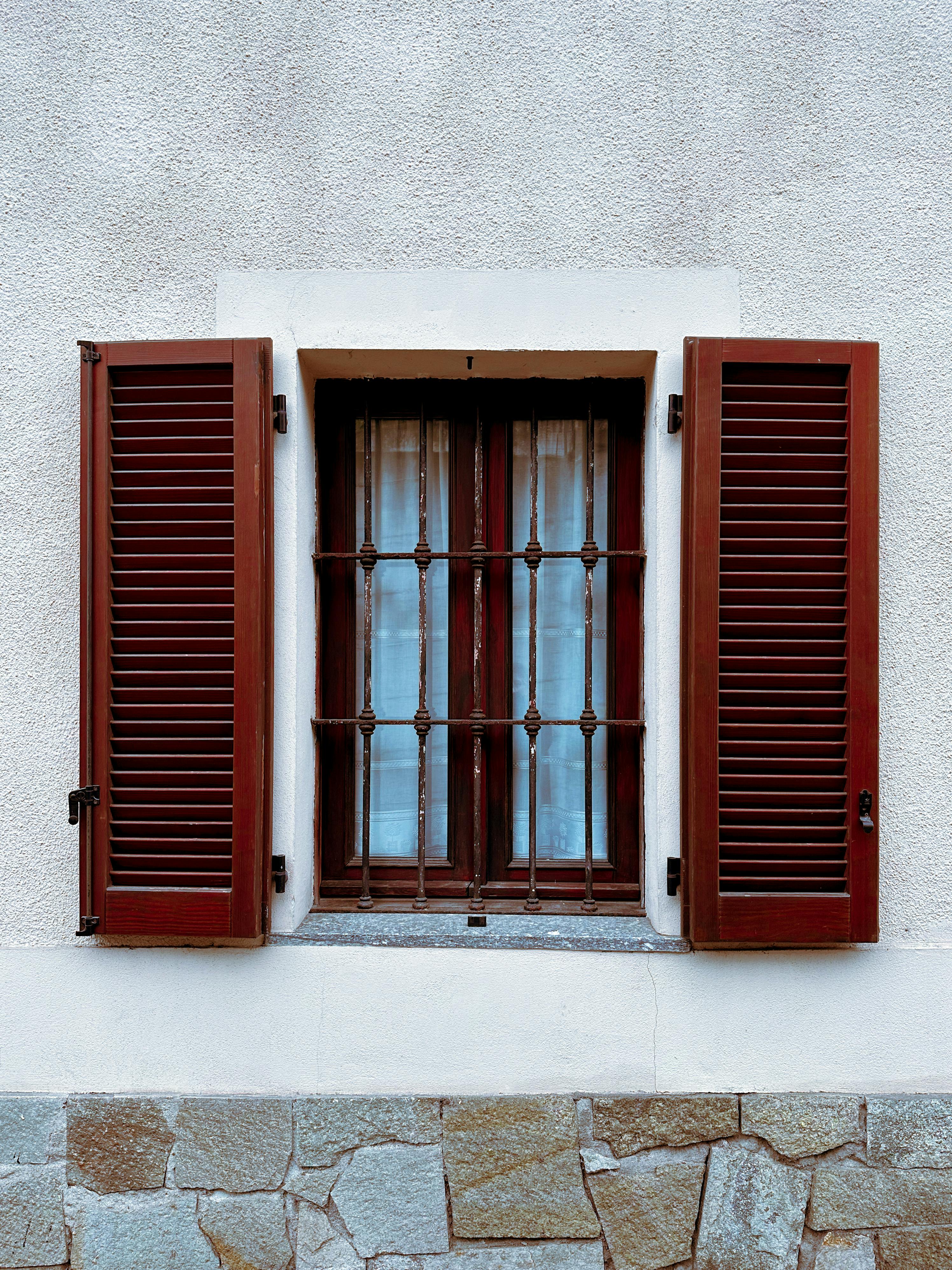 Shutters and Bars on Windows · Free Stock Photo