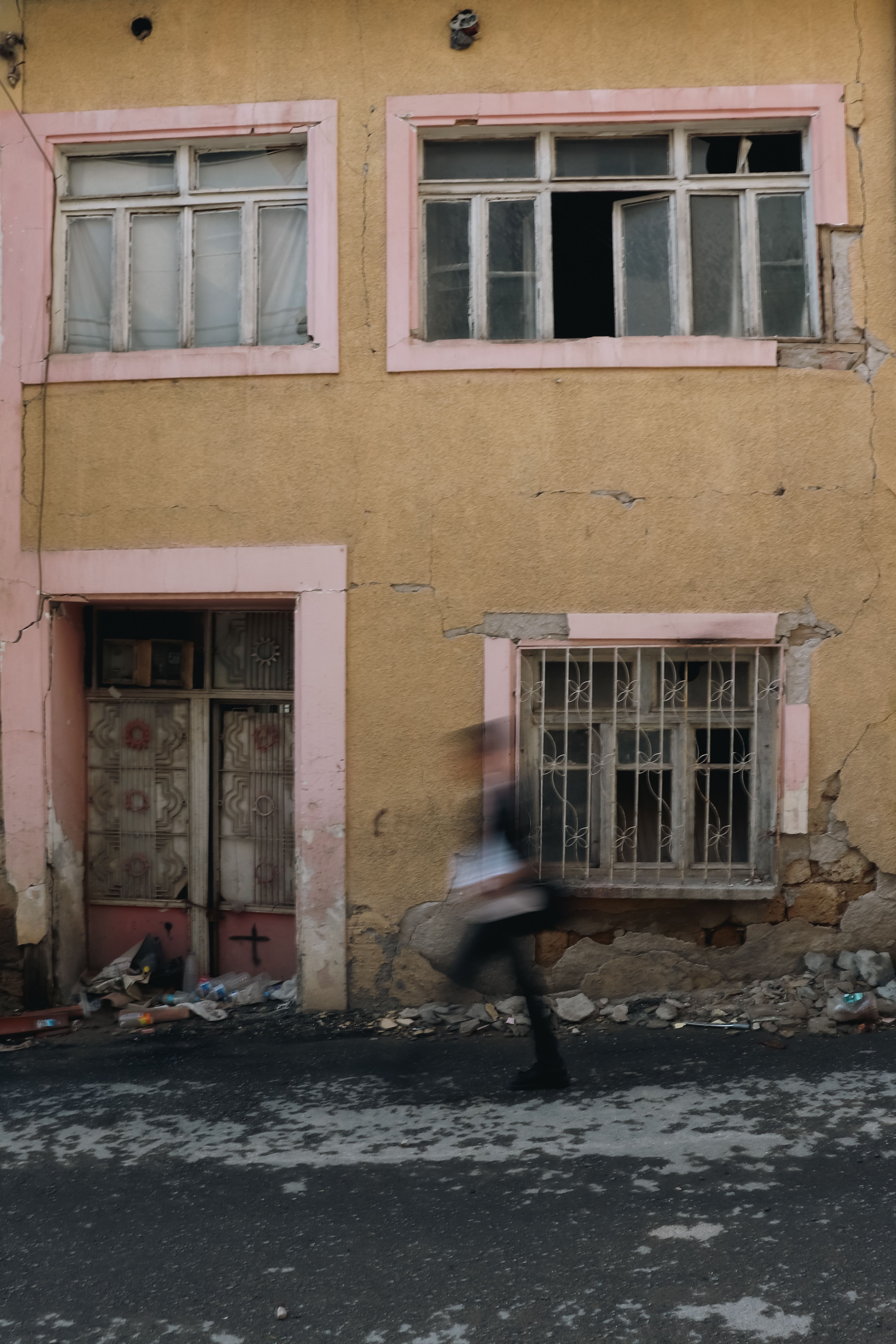 Blurred Man Walking near Building · Free Stock Photo