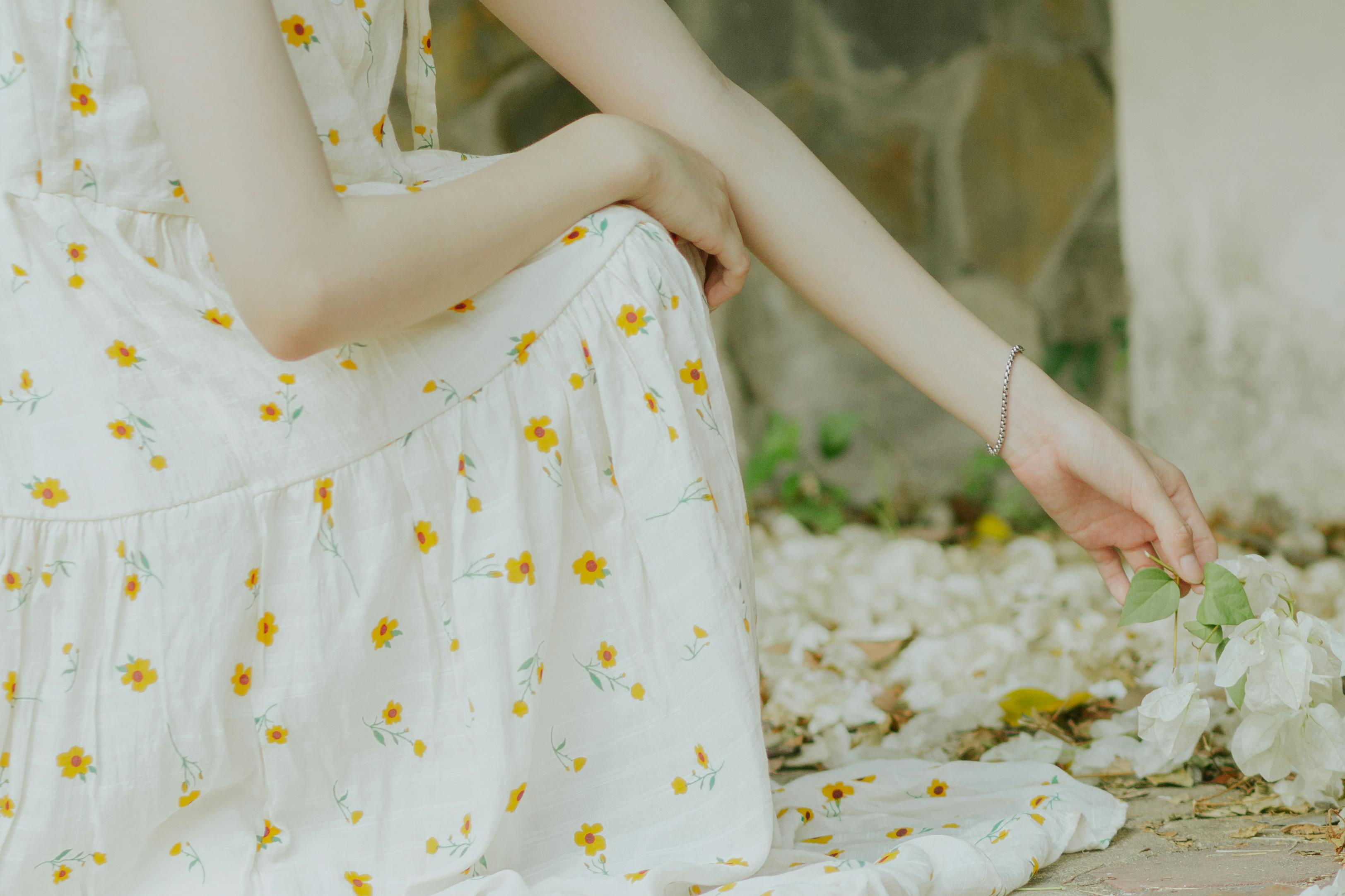 A Woman Touching a Flower · Free Stock Photo