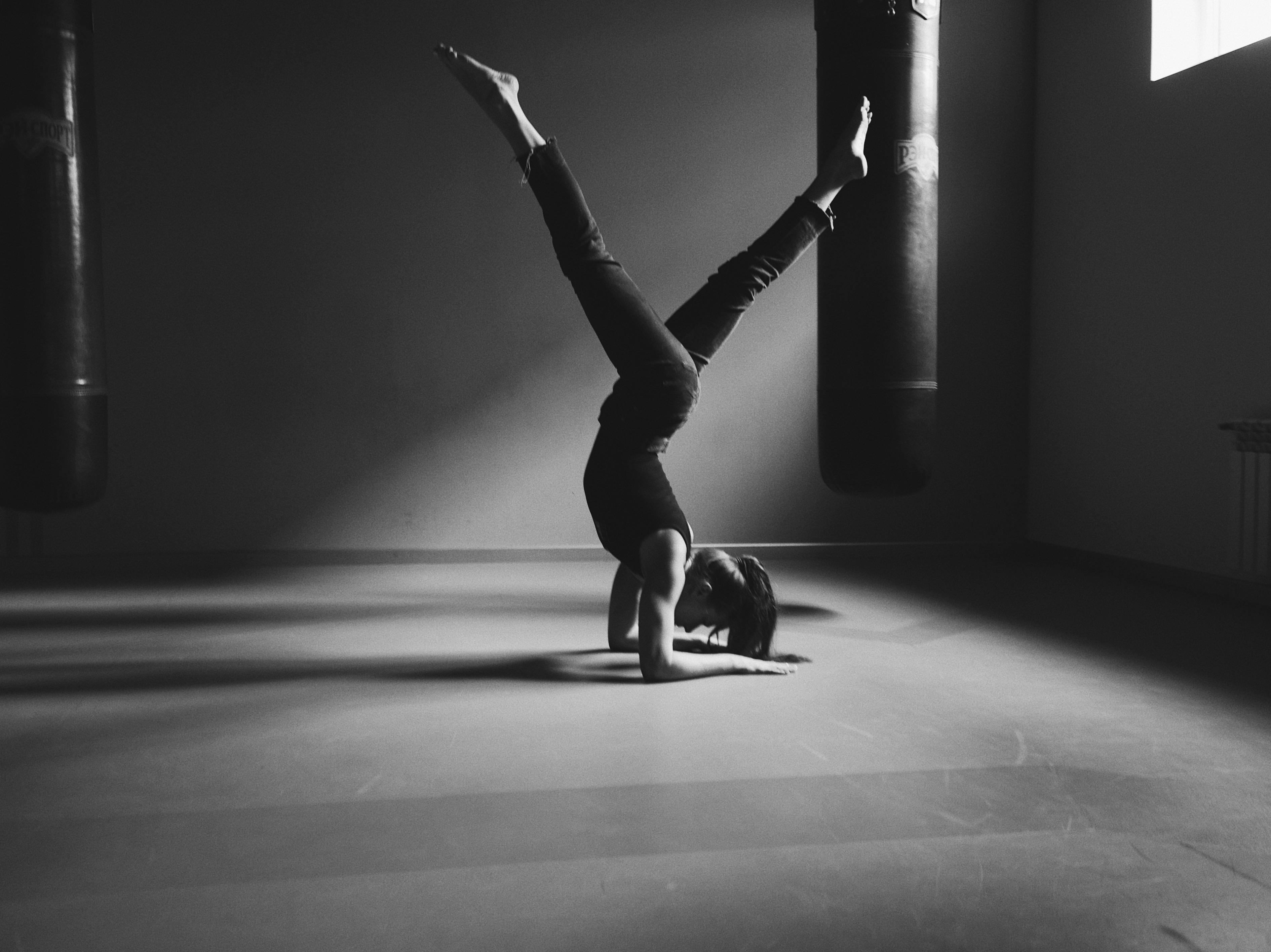Grayscale Photo Of Woman Exercising · Free Stock Photo