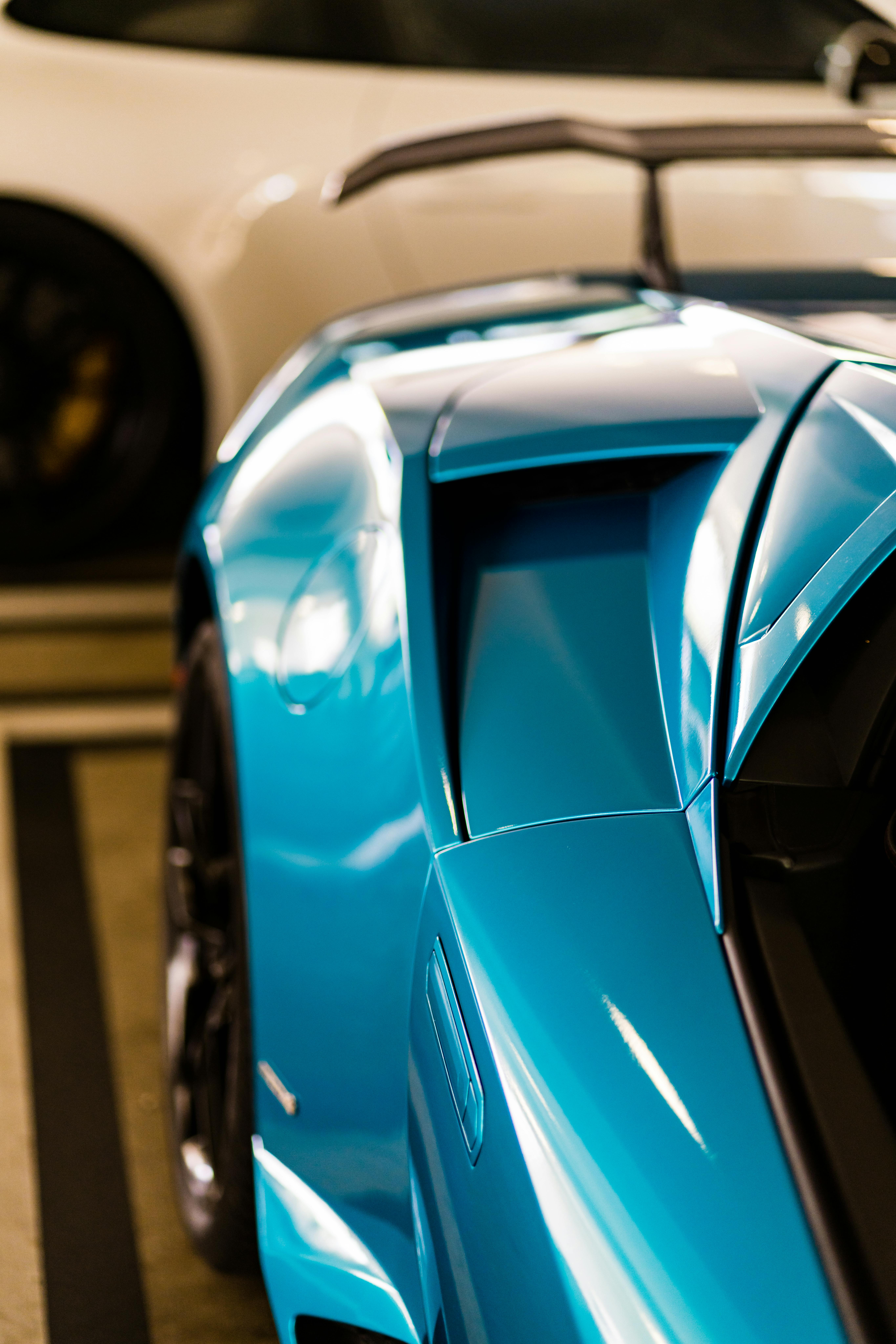 Blue Supercar Livery and Spoiler behind · Free Stock Photo