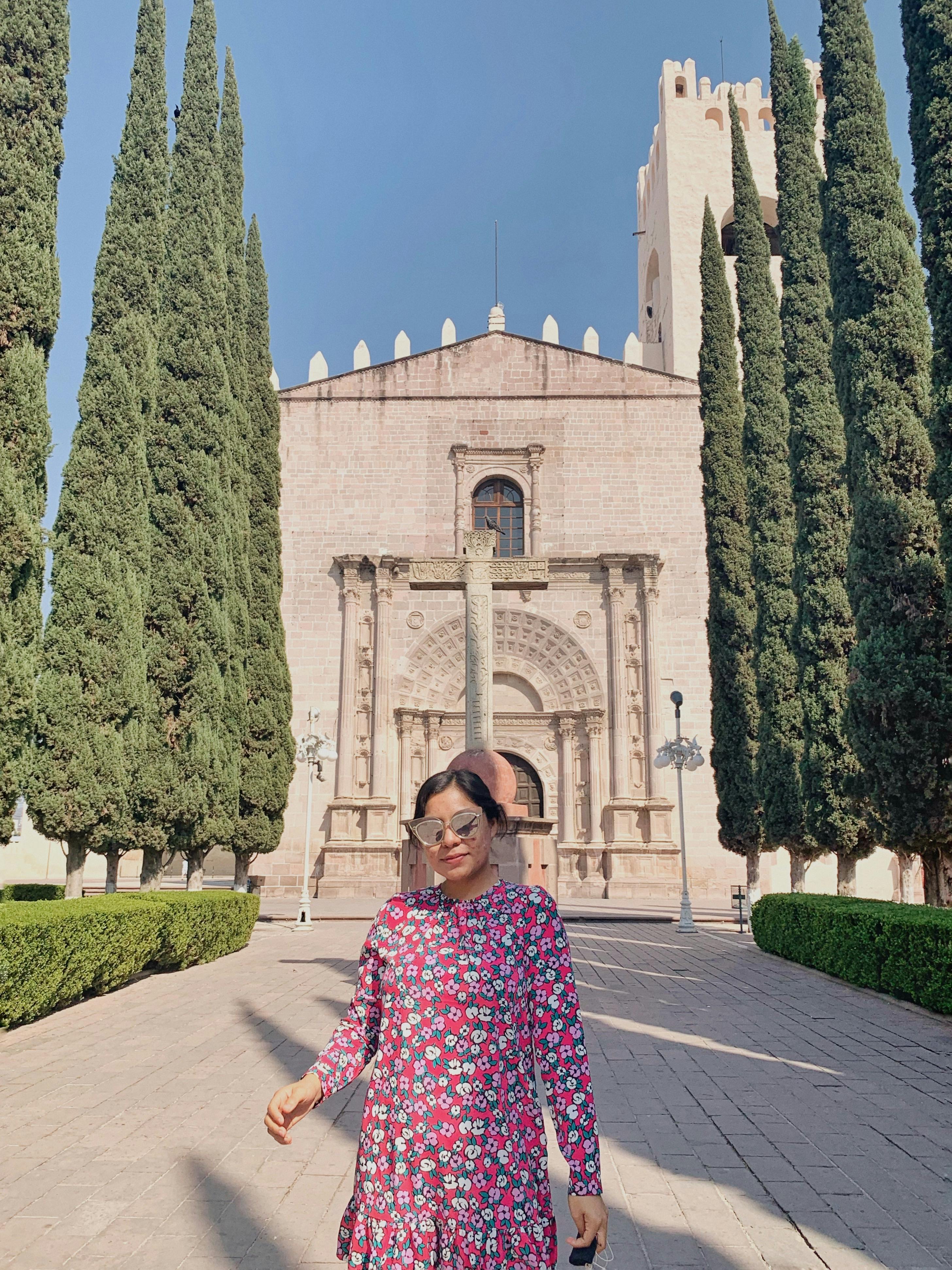 Woman Posing in Dress with Building behind · Free Stock Photo