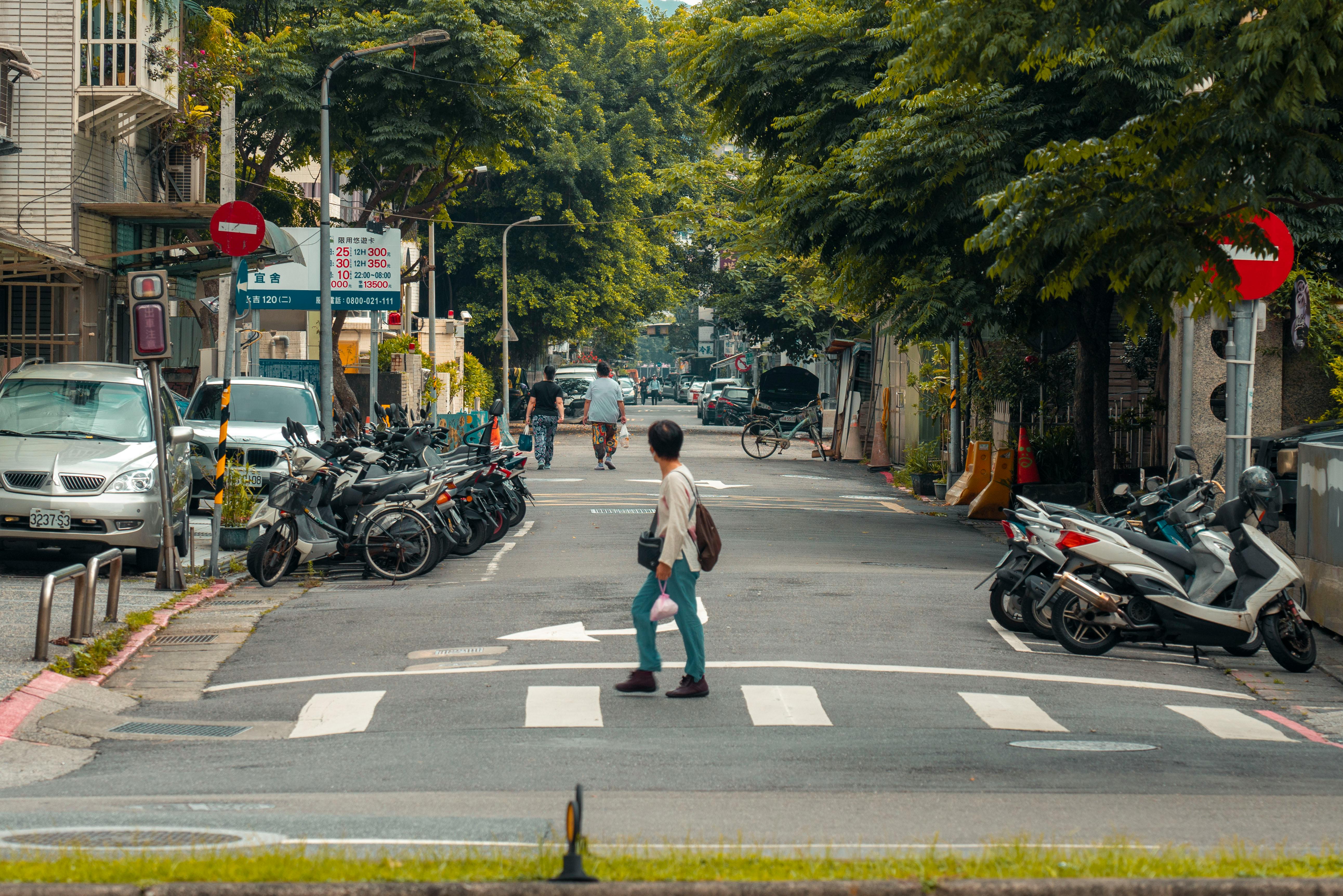 Monochrome Photography of People Crossing The Road · Free Stock Photo