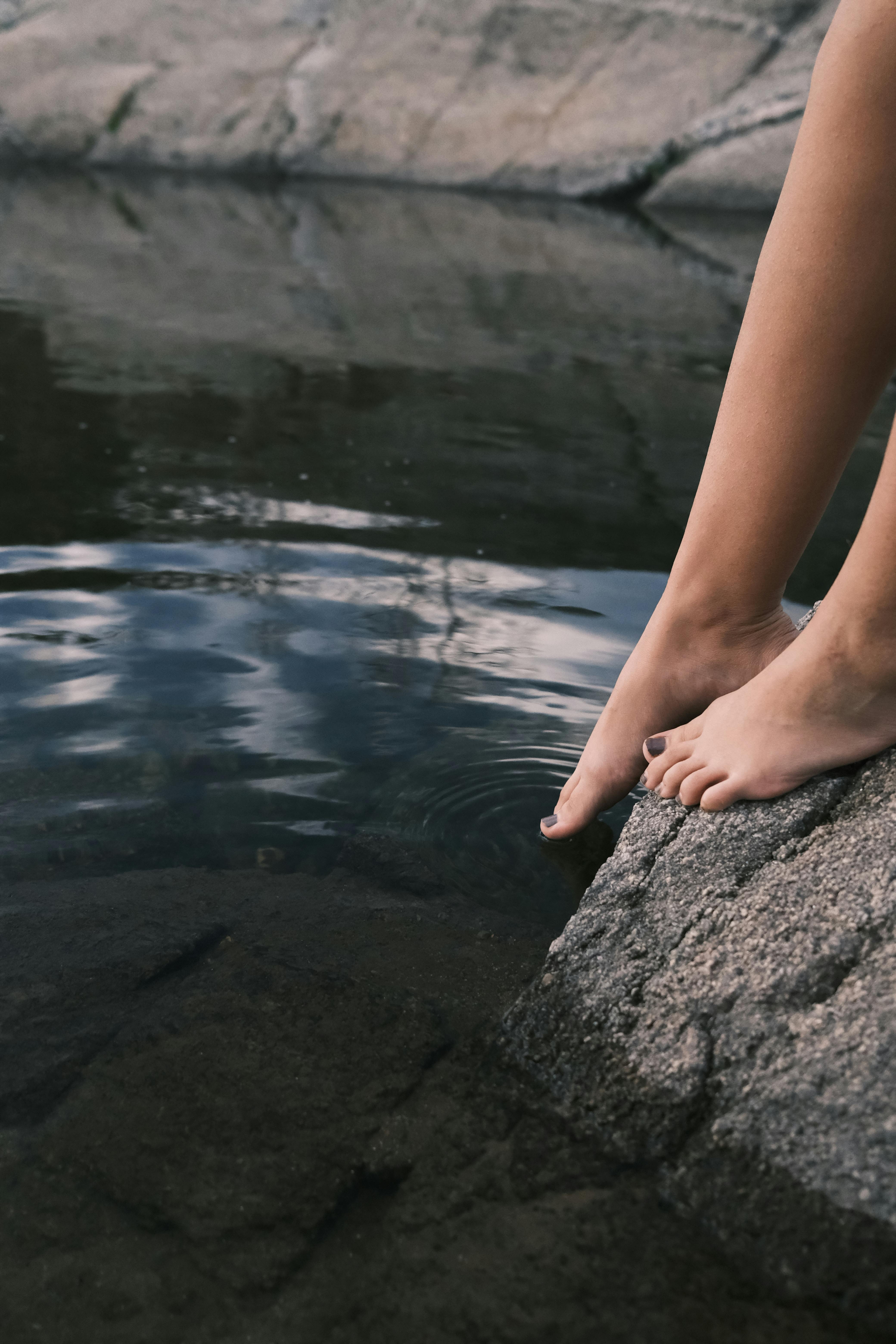 Serene Barefoot Moment by Tranquil Lake · Free Stock Photo