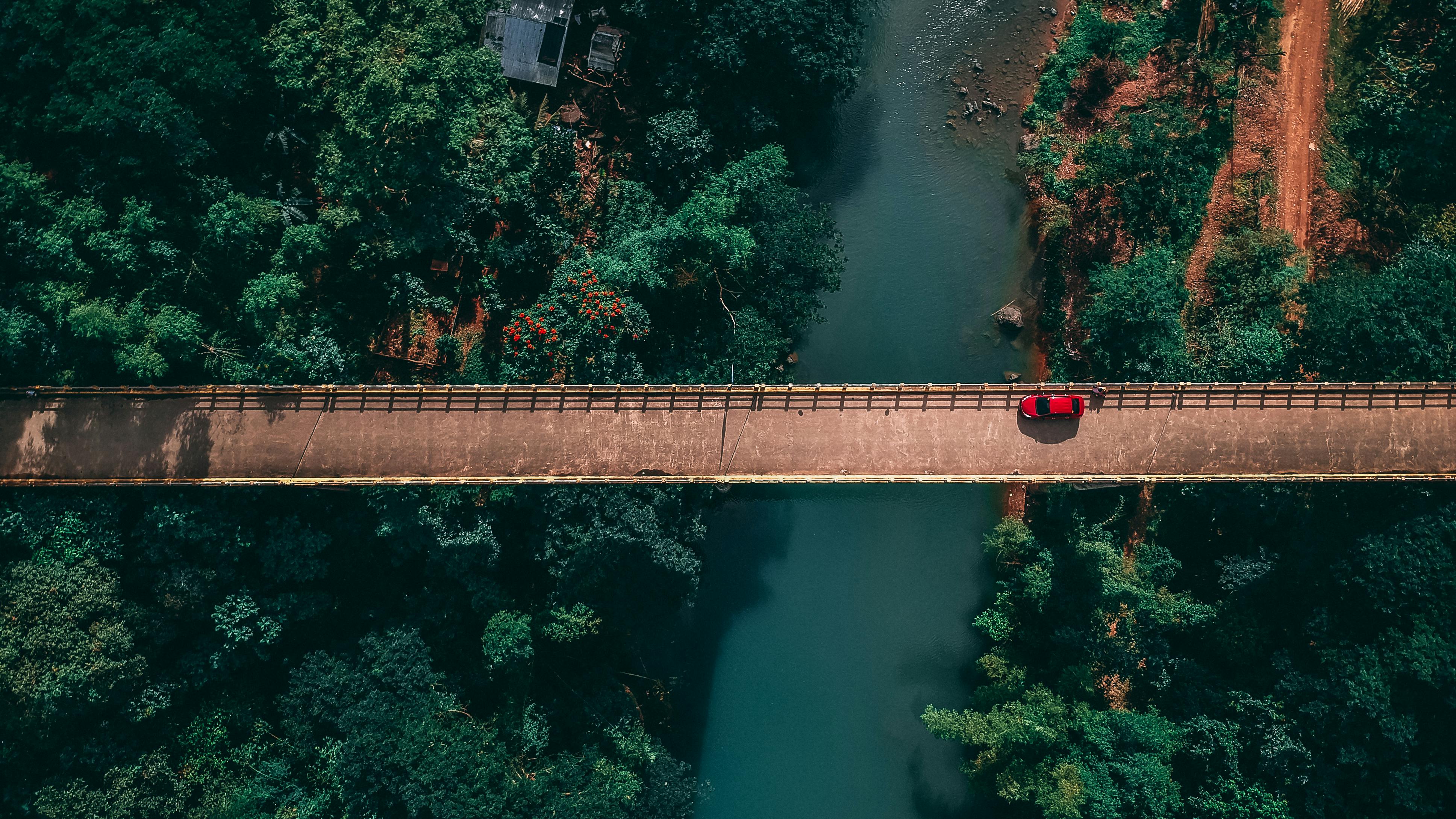 Aerial Photo Of Red Car On Bridge · Free Stock Photo