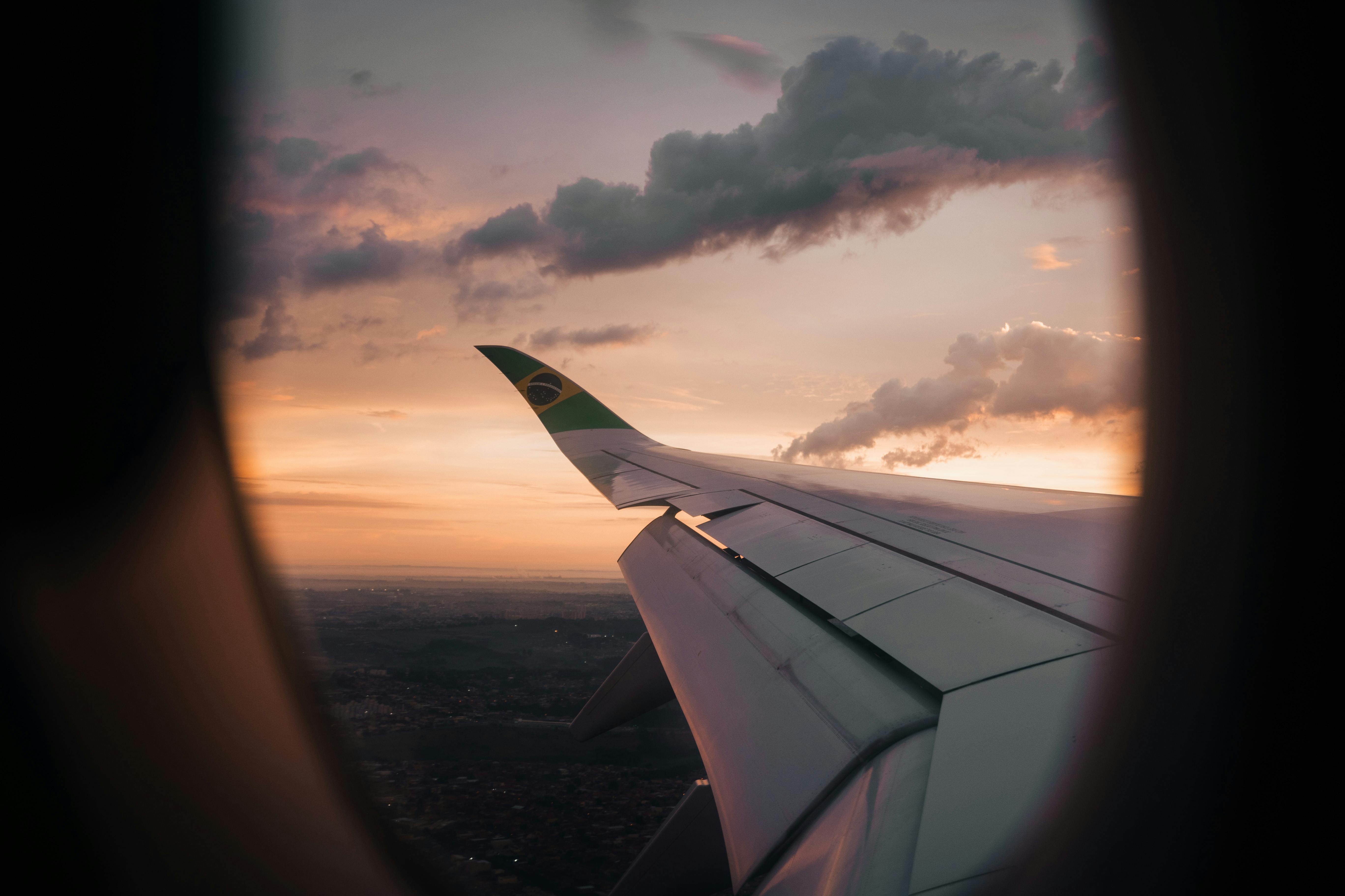 Wing of Flying Brazilian Airplane · Free Stock Photo