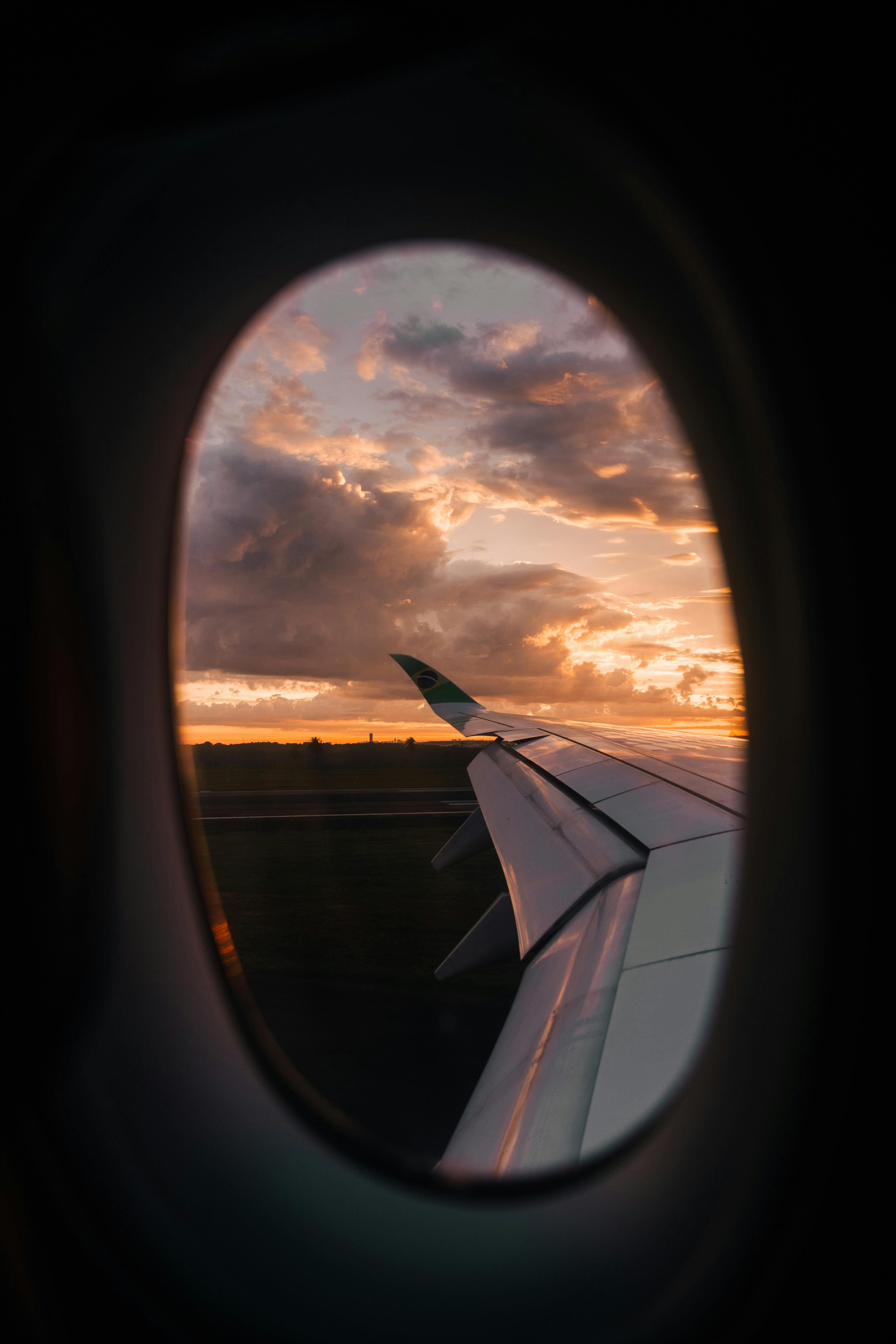 View of the Sunset from a Plane Window · Free Stock Photo