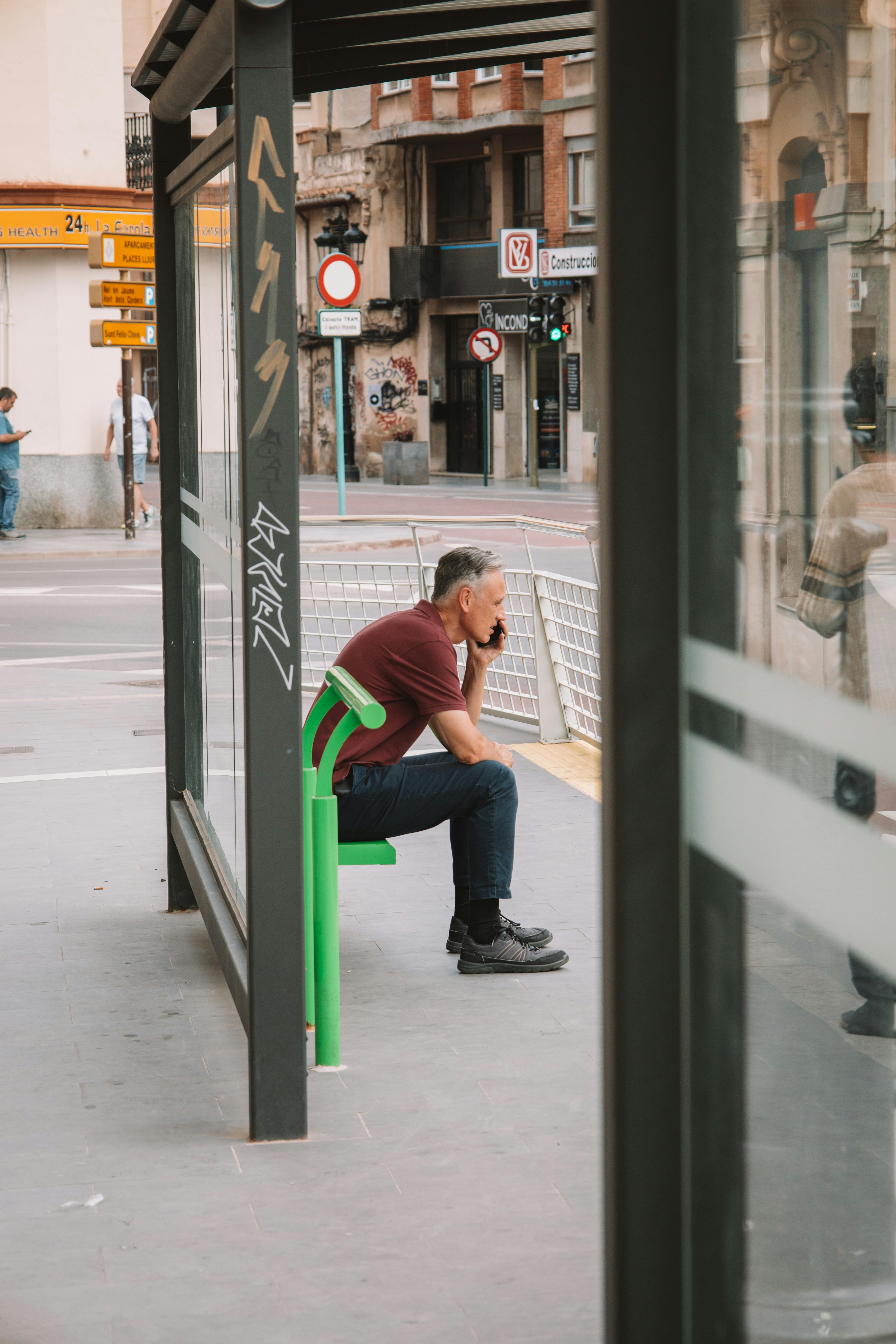 Man at Bus Stop · Free Stock Photo