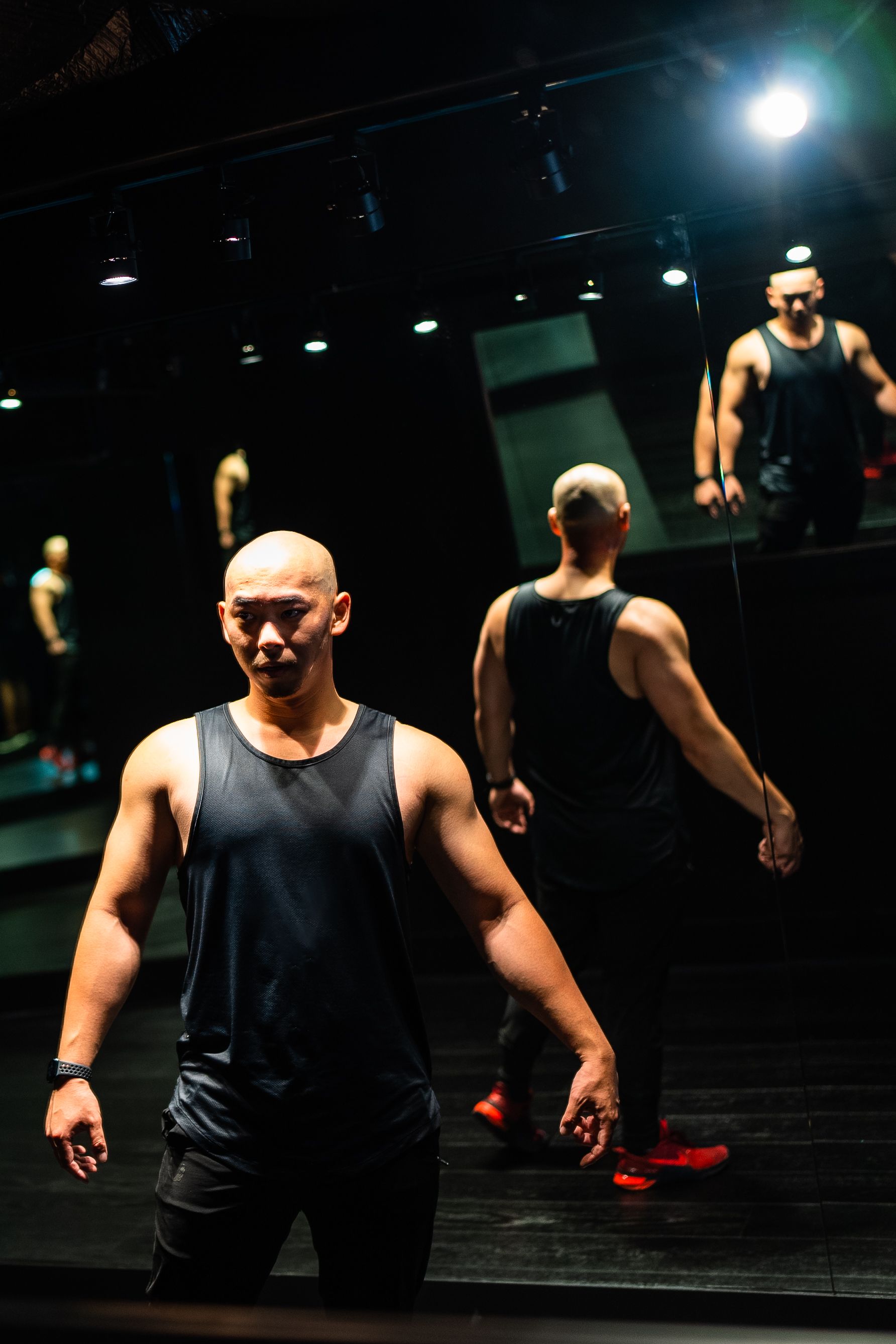 A Muscular Man Reflecting in Mirrors · Free Stock Photo
