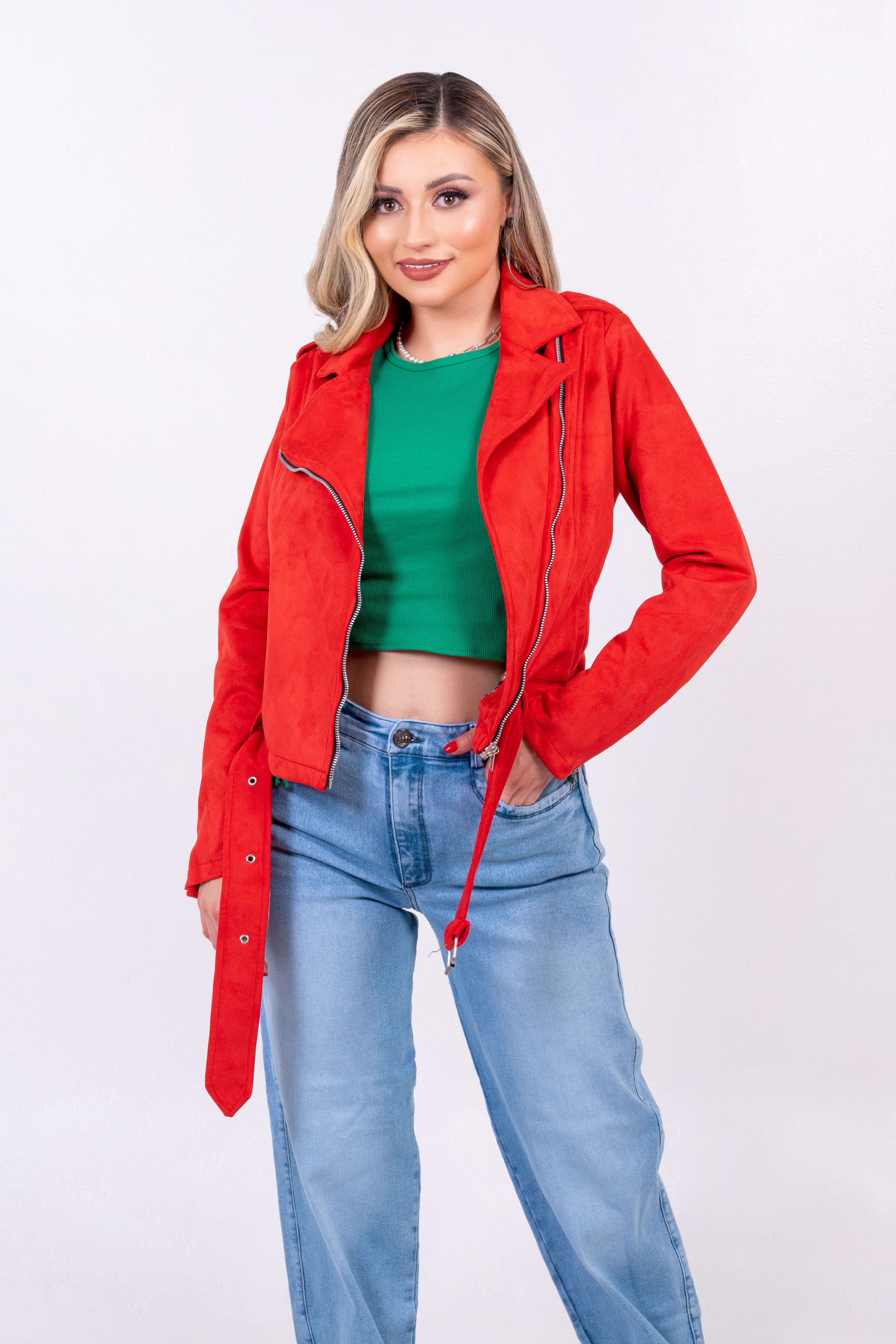 Woman Wearing Red Jacket and Distressed Blue Denim Skinny Jeans Sitting ...