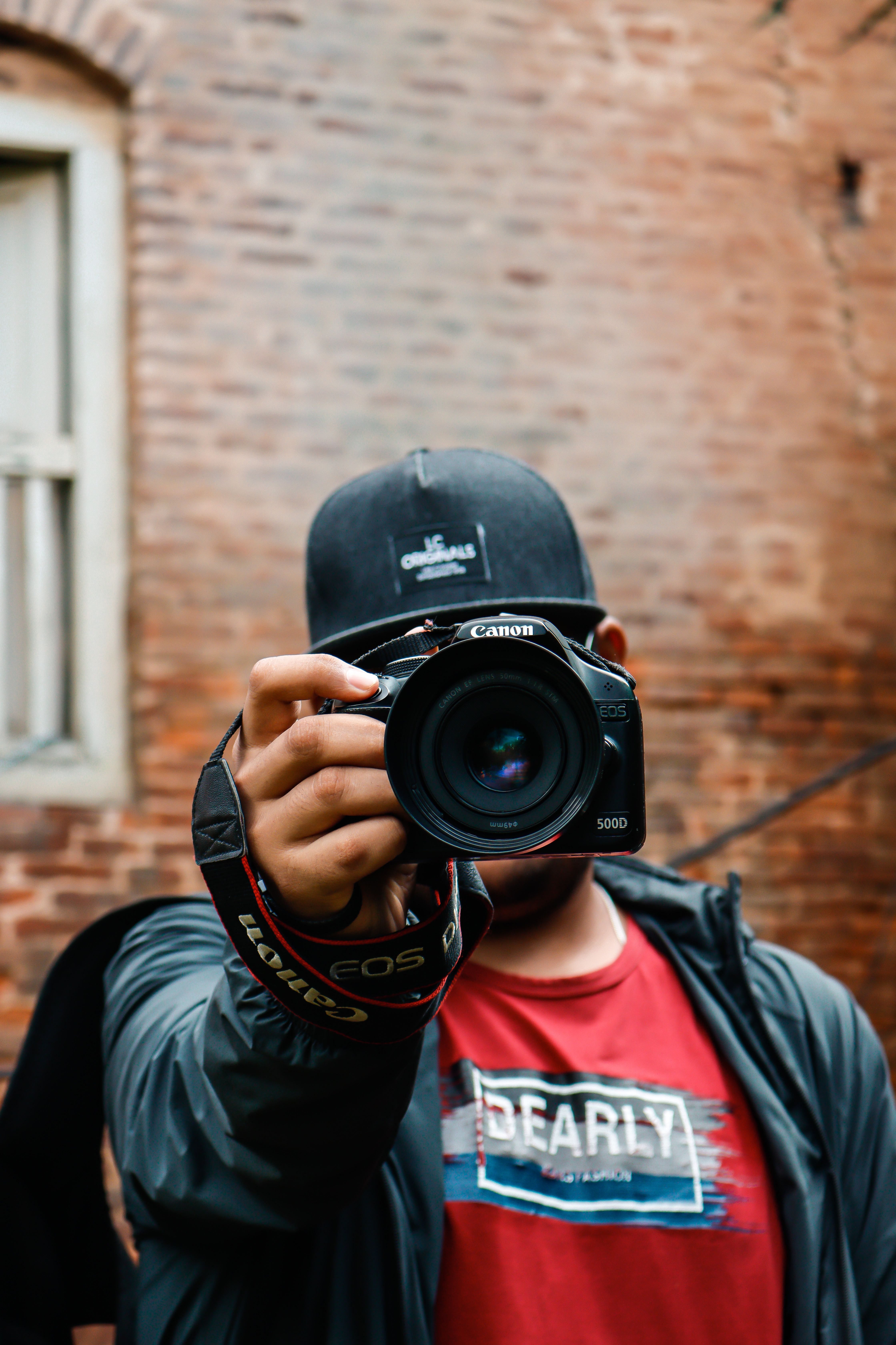 Canon Camera in Photographer Hand · Free Stock Photo