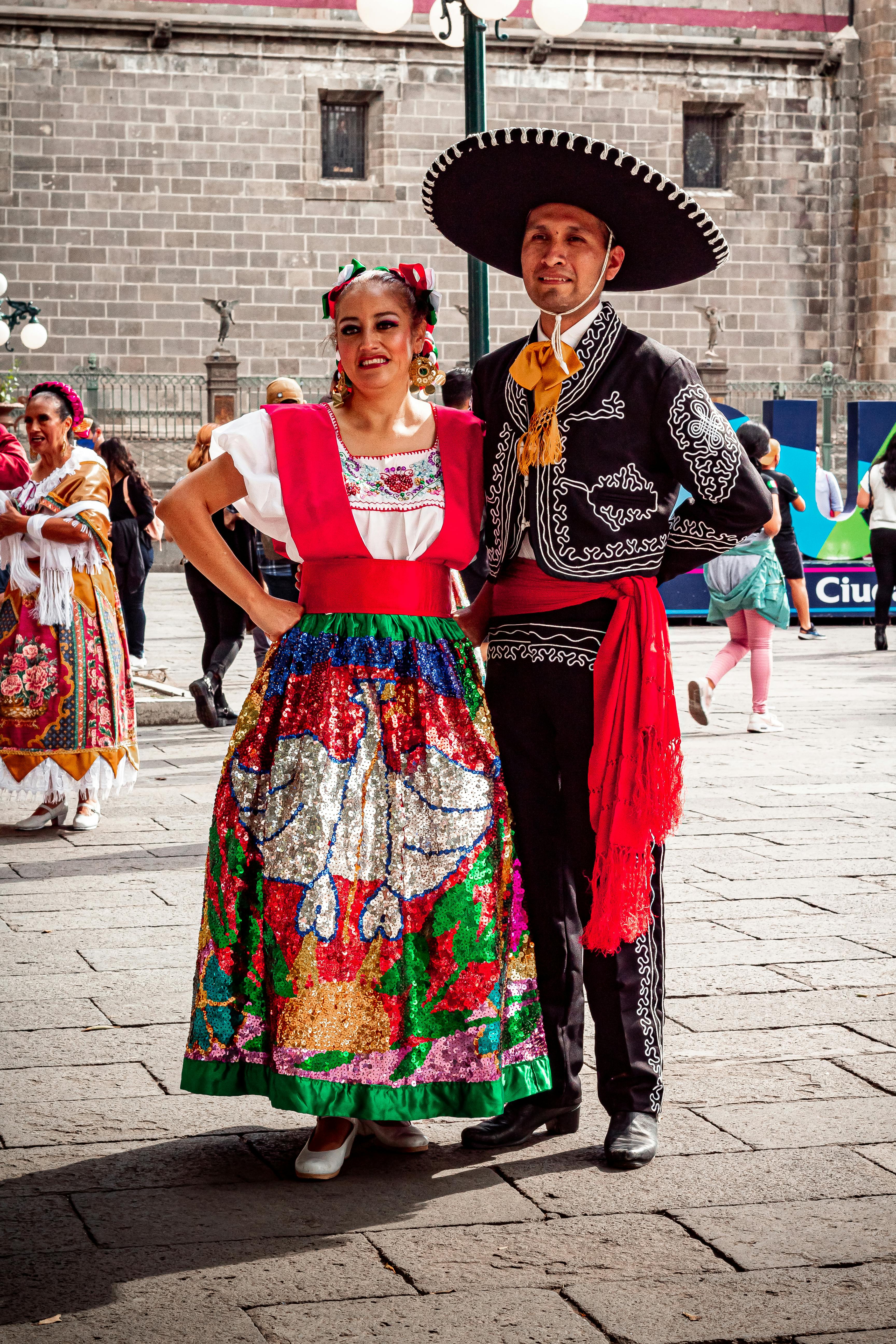 Mexican Dancers in Traditional Costumes Posing on Street · Free Stock Photo