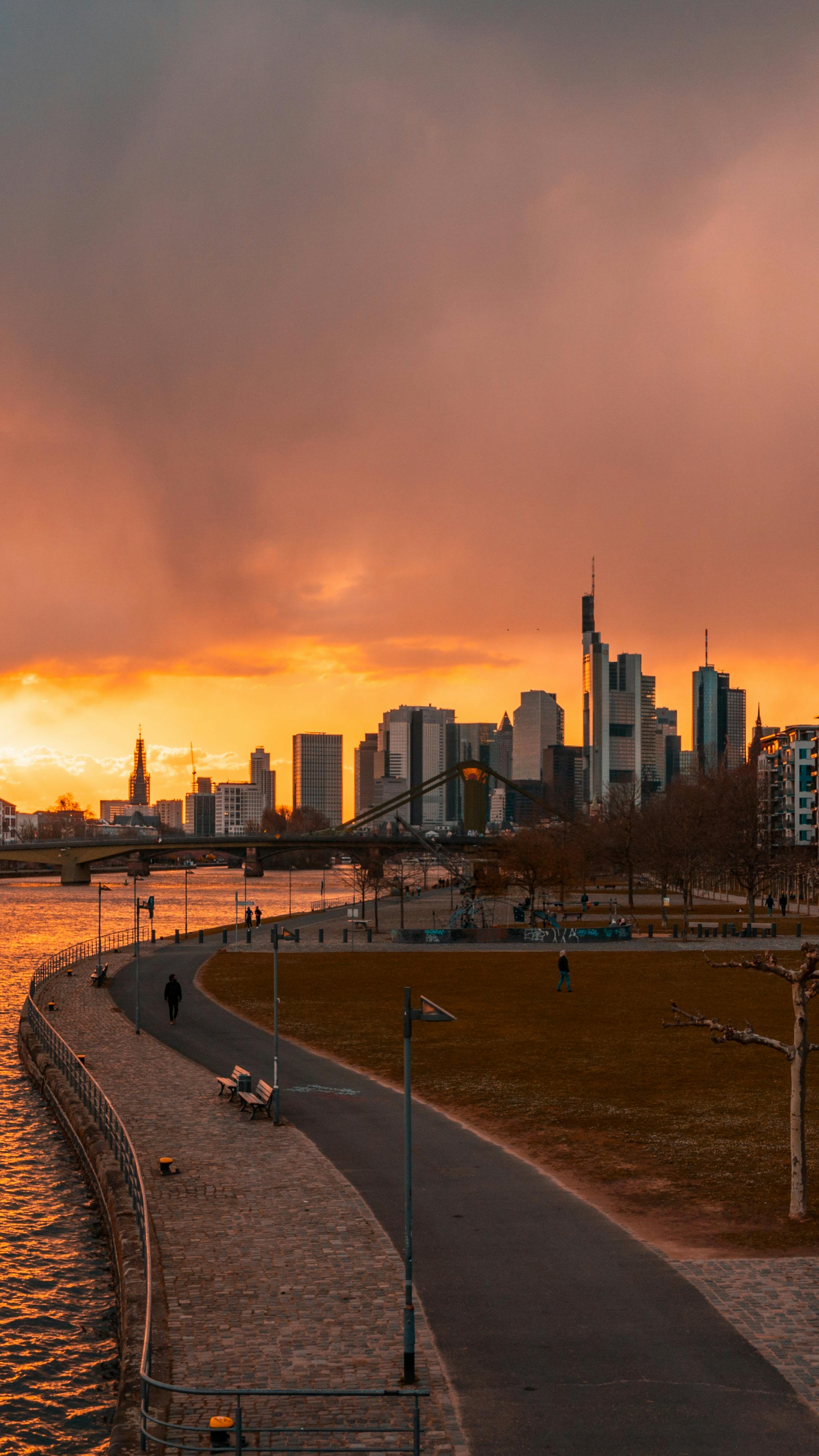 Promenade and Cityscape at Sunset · Free Stock Photo