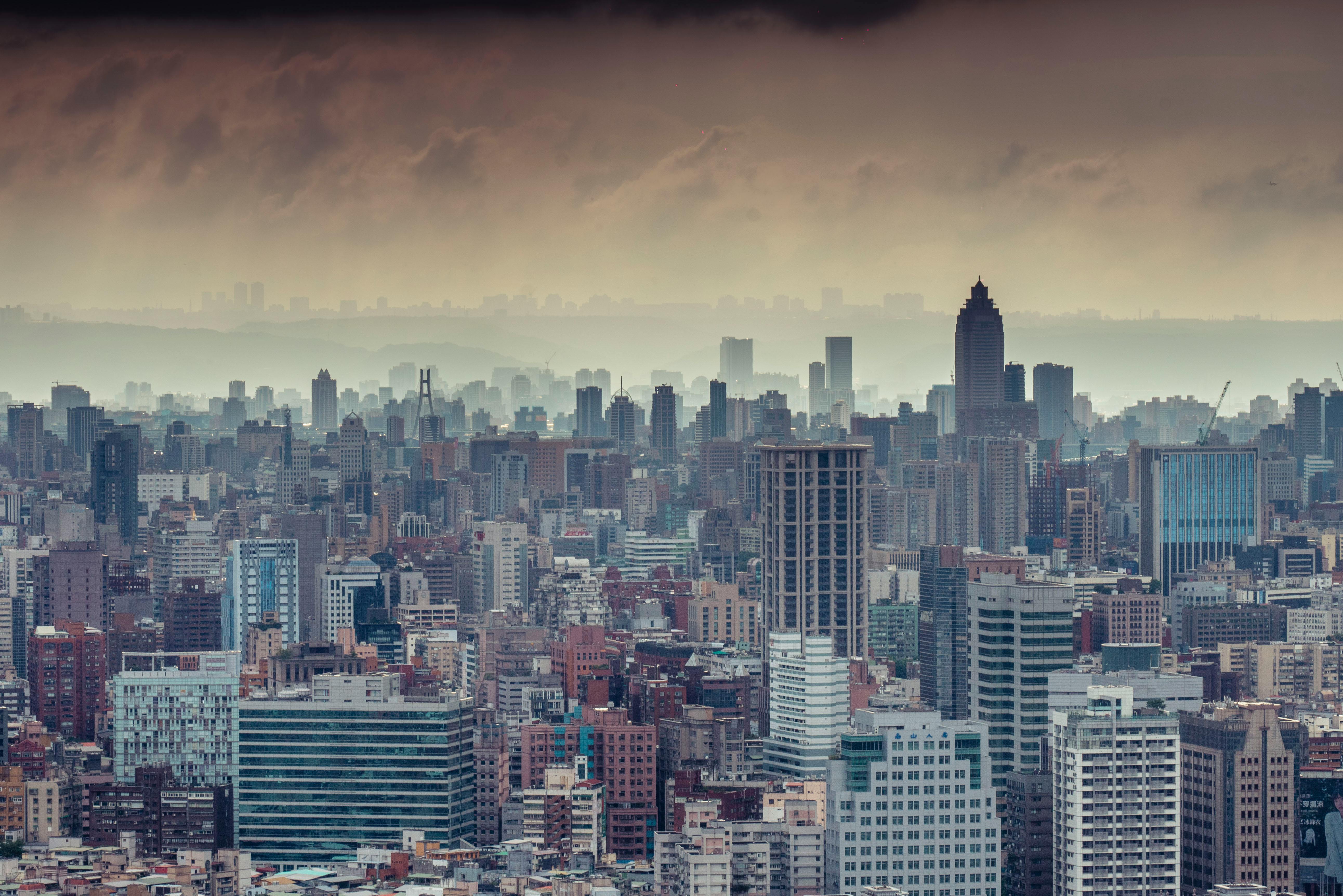 Rain Cloud over City at Sunset · Free Stock Photo