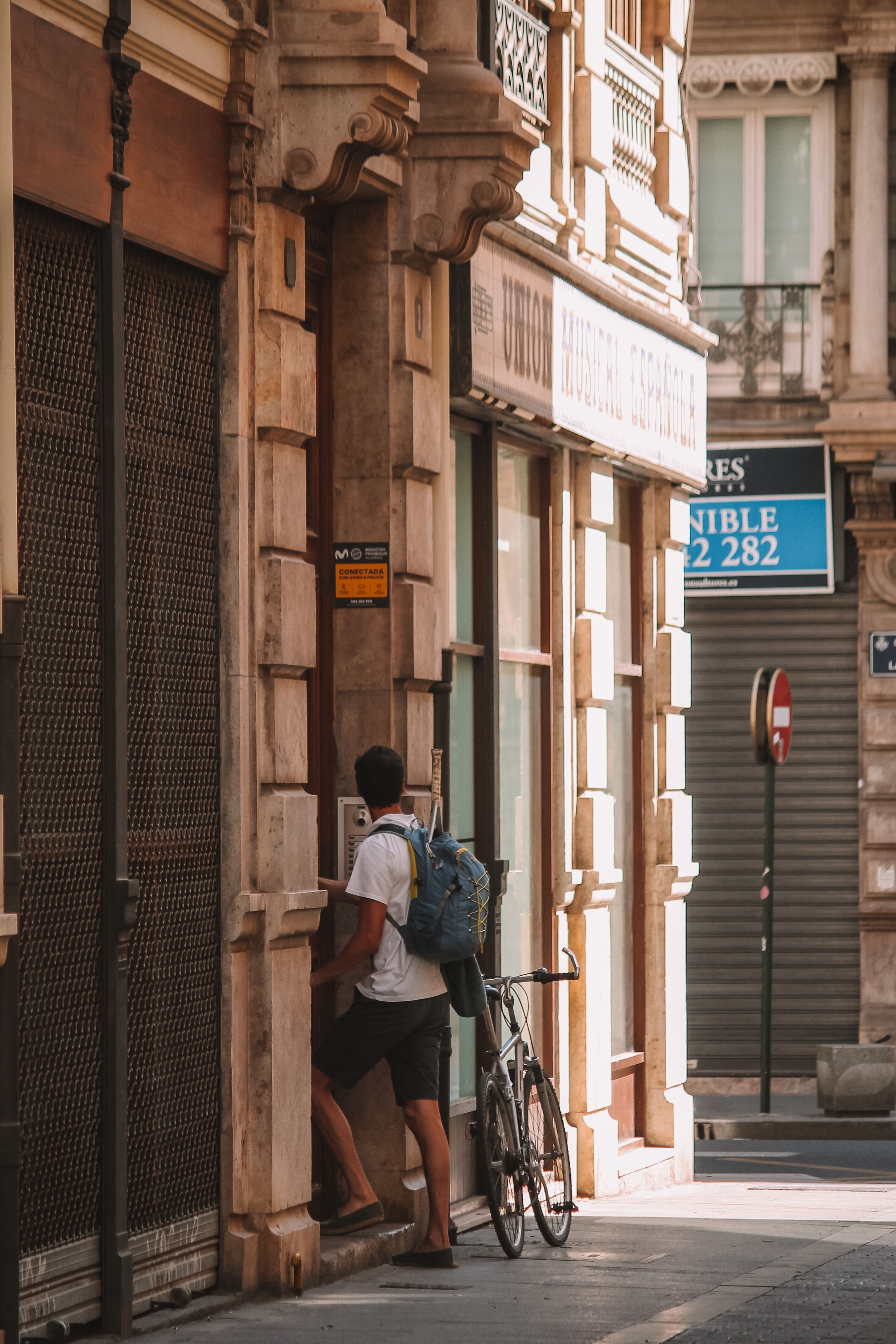 Man Entering to Residential Building · Free Stock Photo